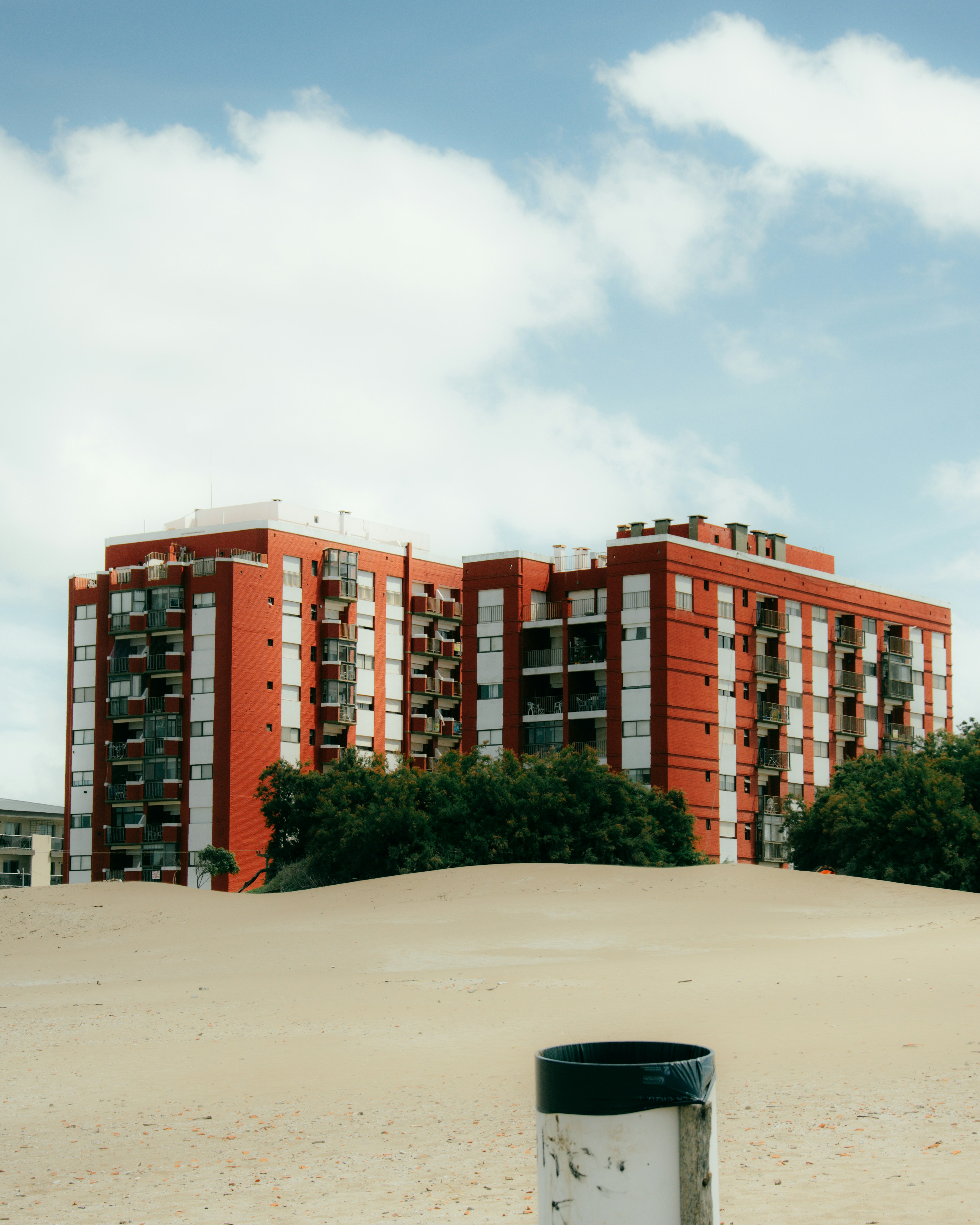 Crimson Towers Rising Over Wind-Swept Dunes
