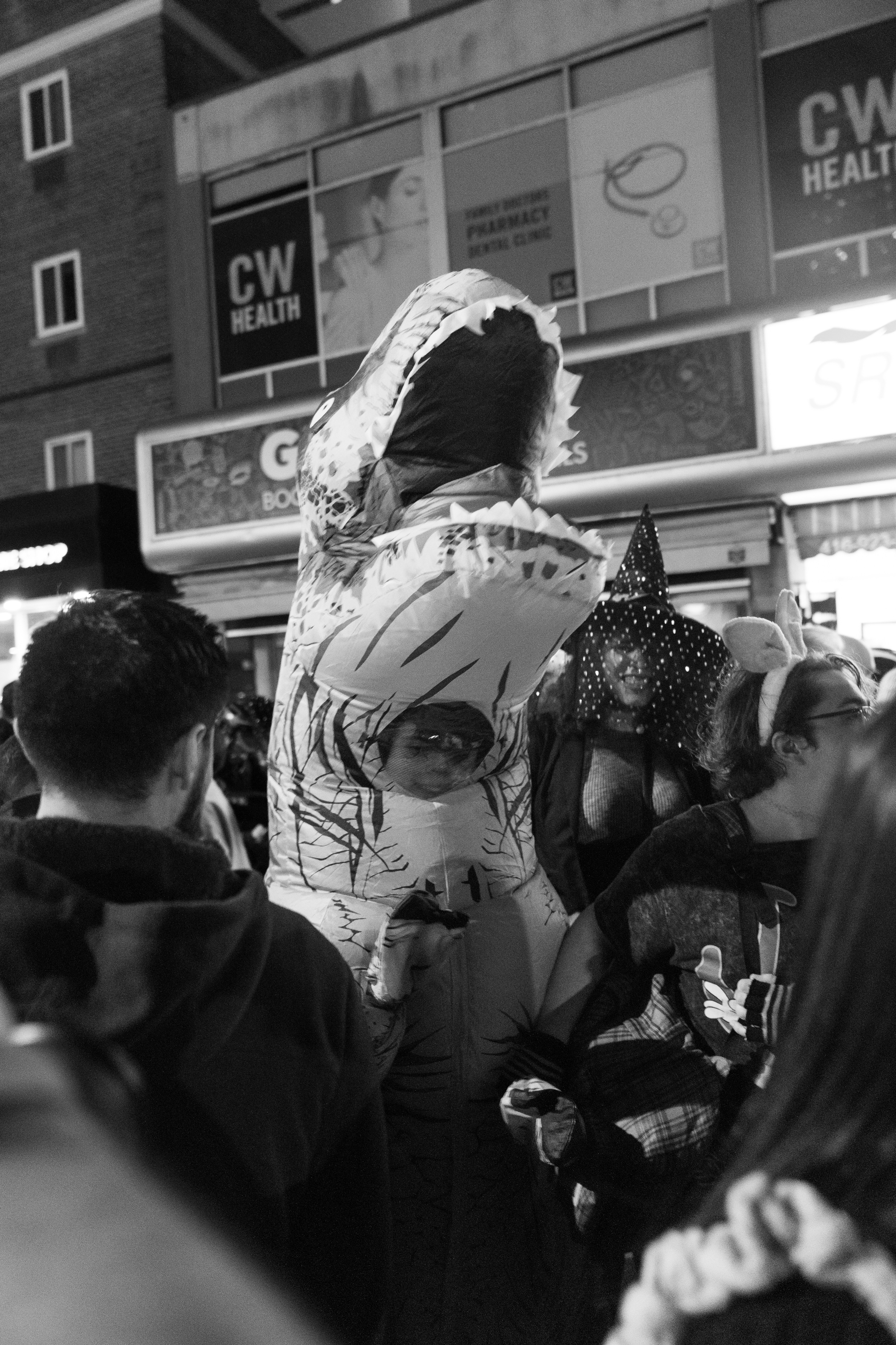 Moonlit Shark in the Crowd: A Halloween Night in Motion