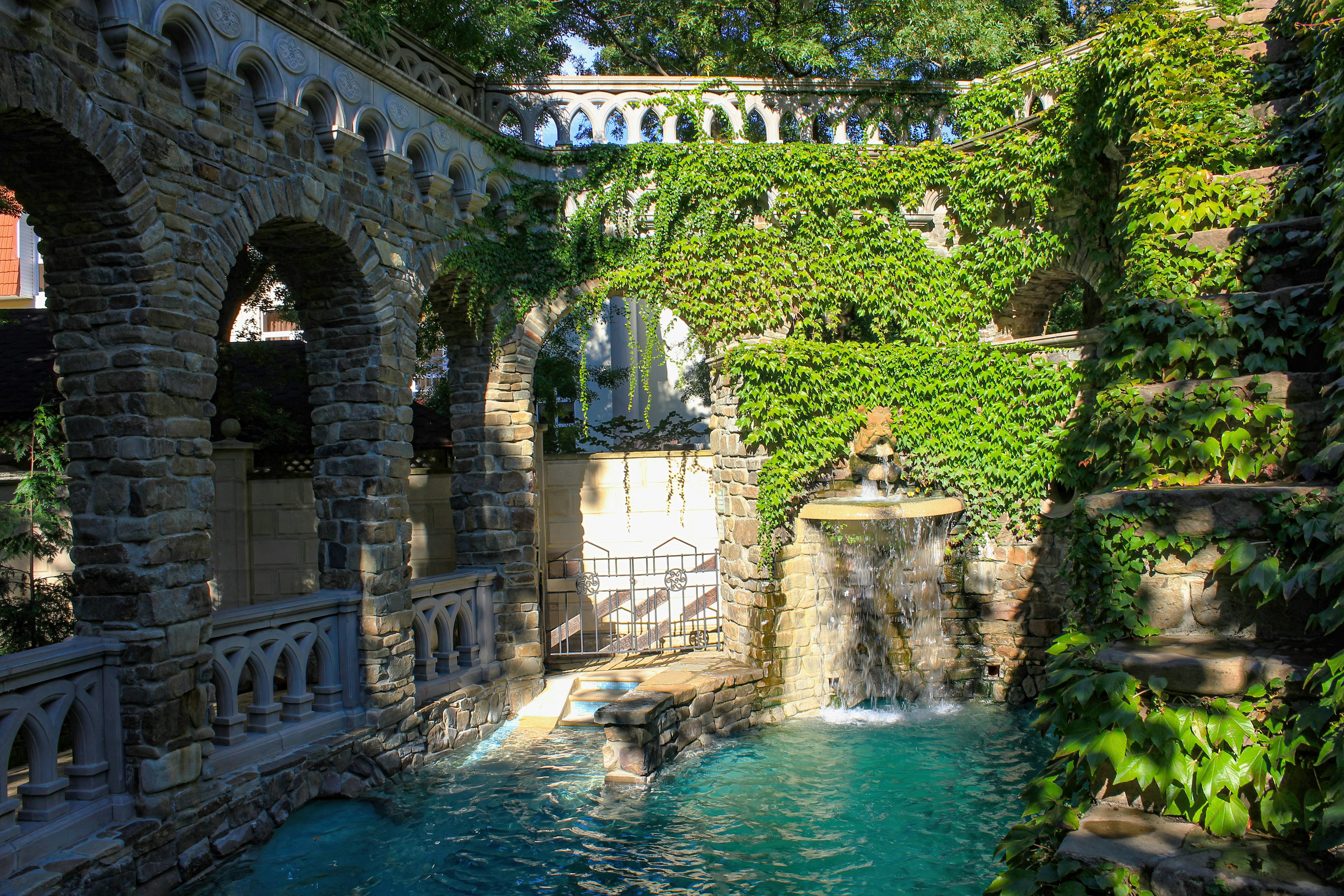 Verdant Arches and Cascade: An Ivy-Cloaked Stone Courtyard