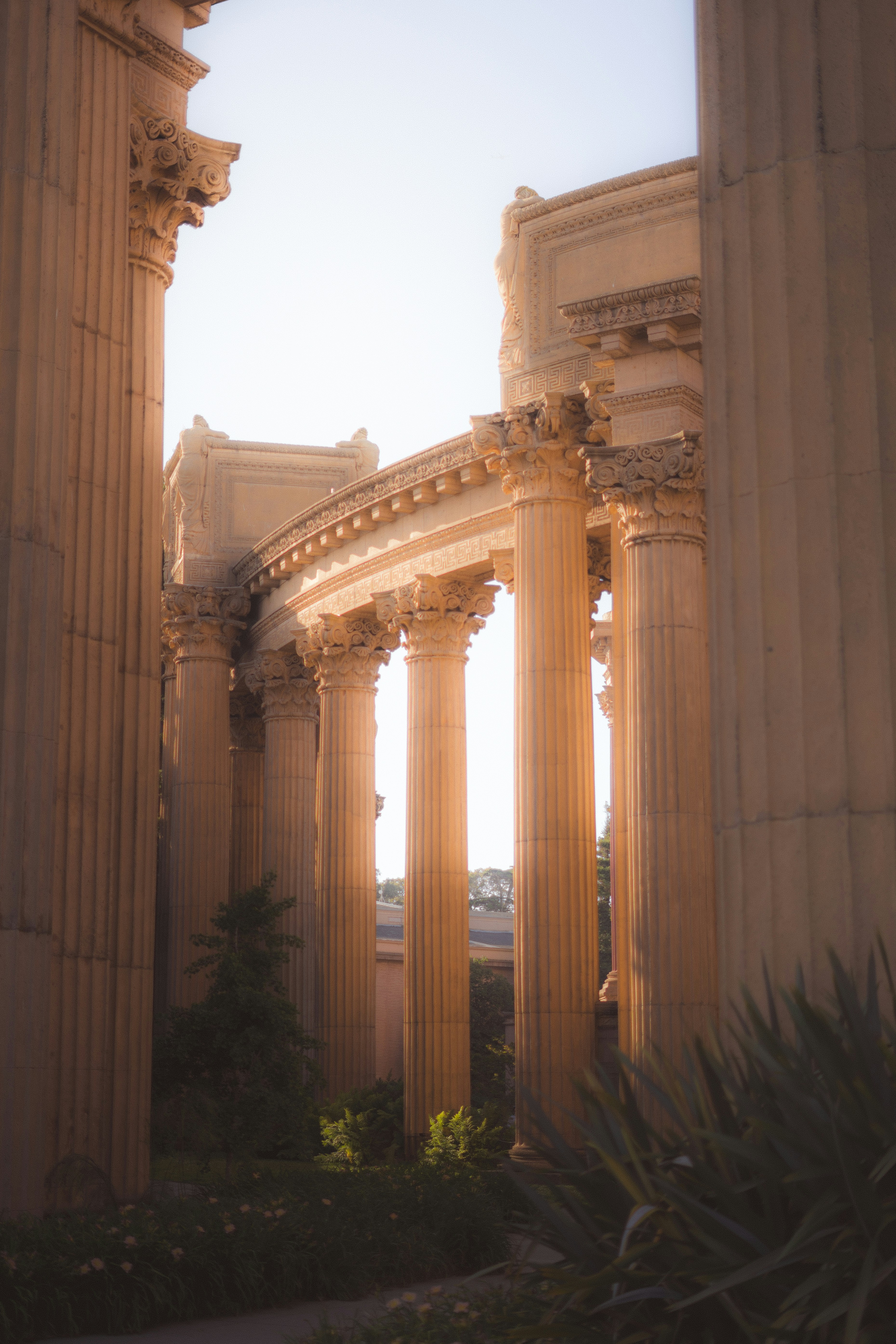 A group of pillars in a courtyard with a sky background photo – Free ...