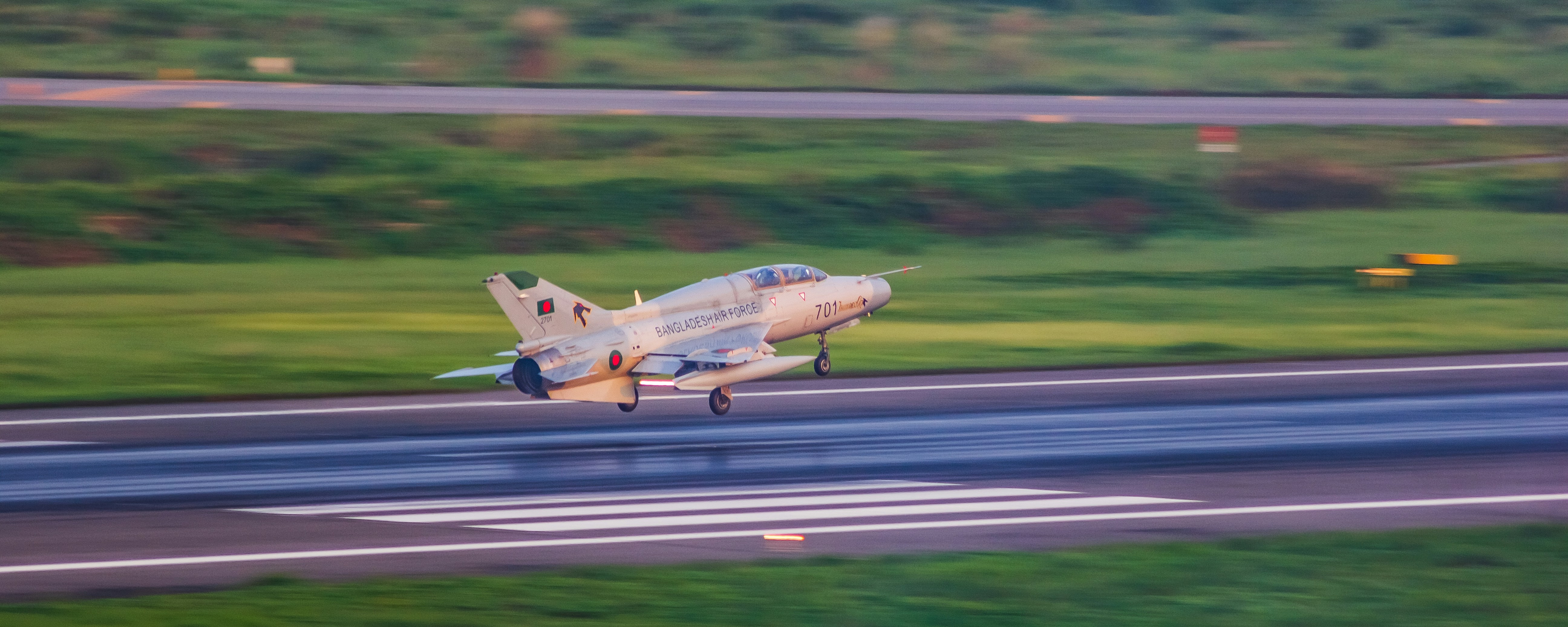 A fighter jet taking off from an airport runway photo – Free Dhaka ...