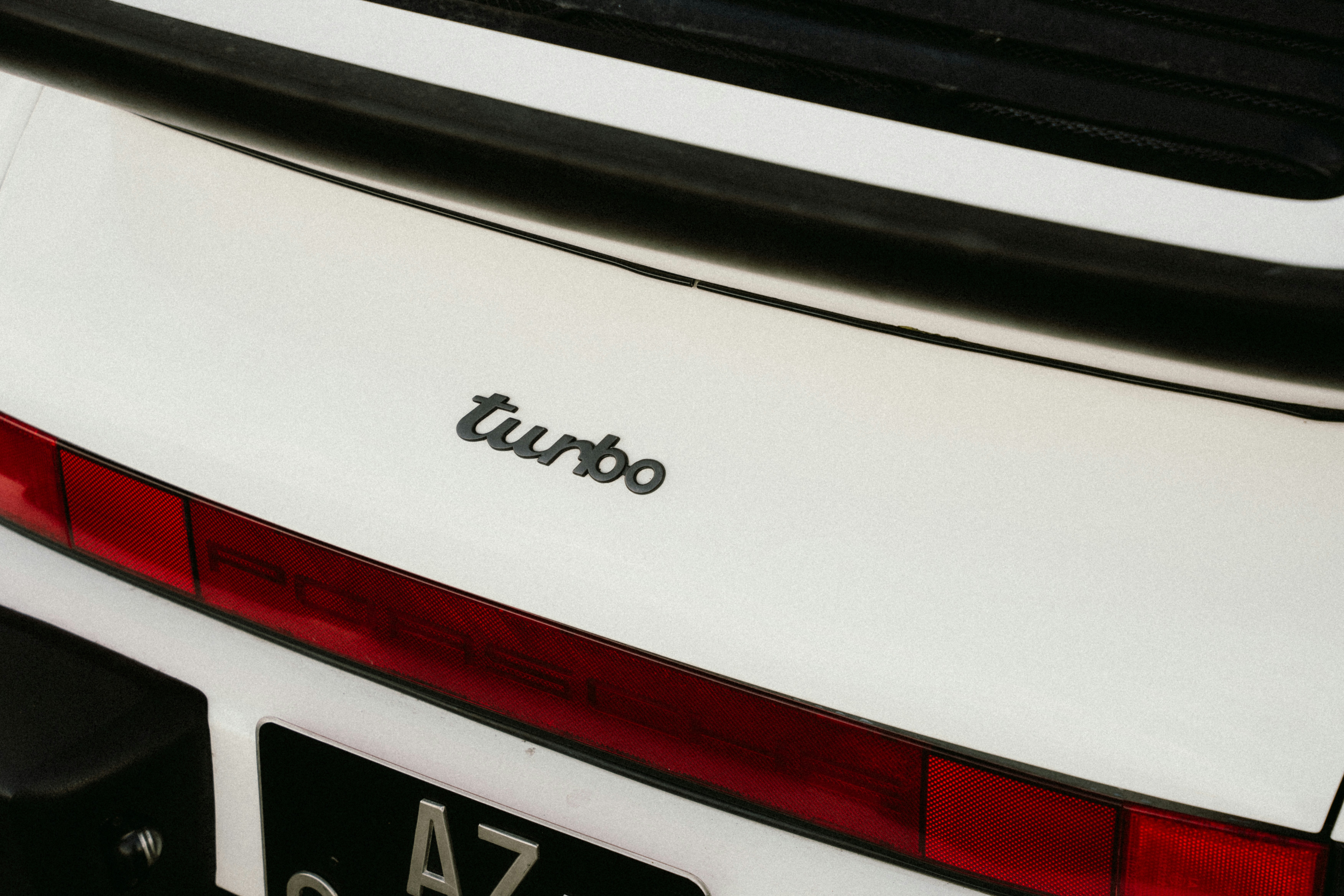 A close up of the rear end of a white car photo – Free Car Image on ...