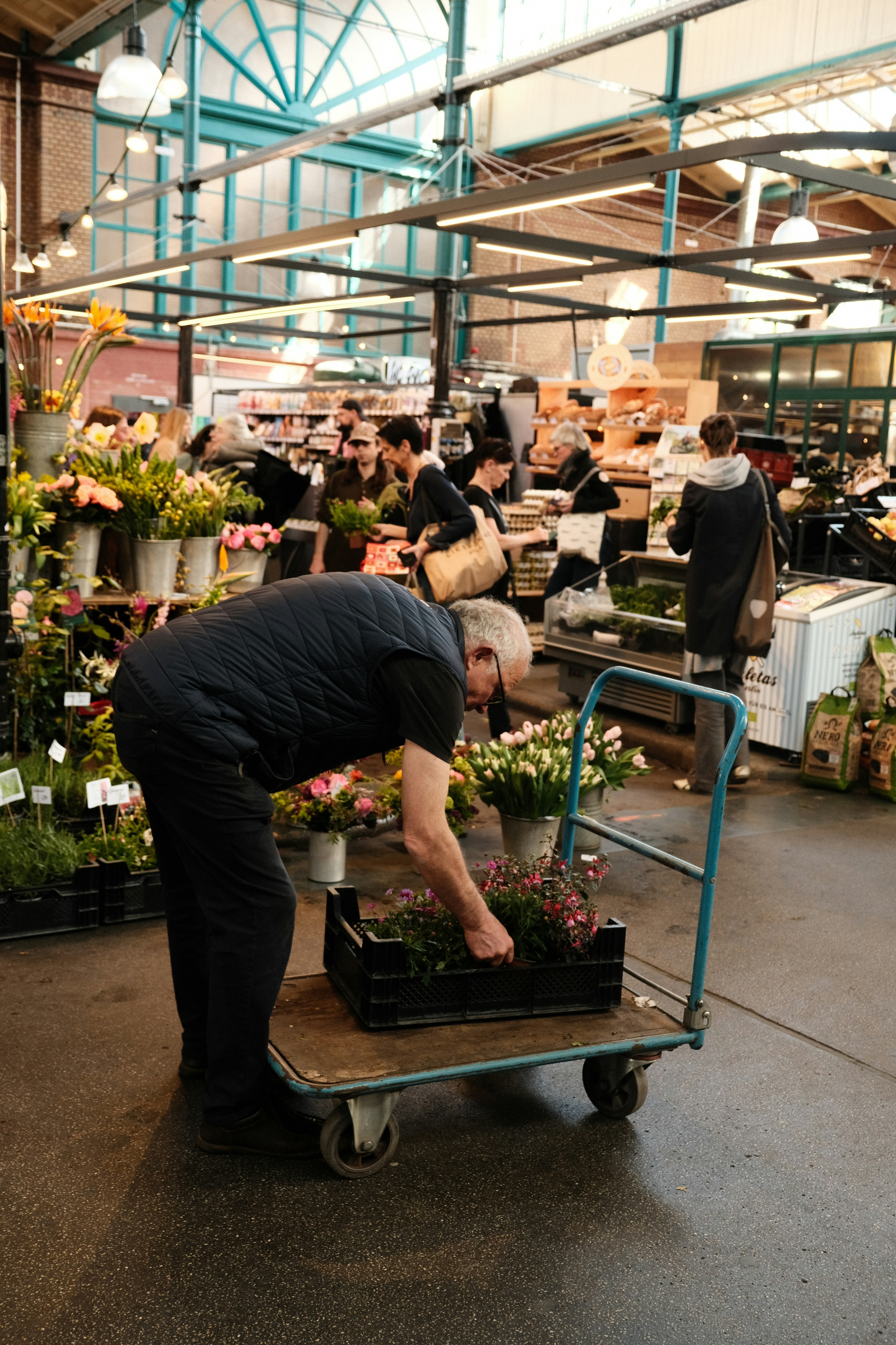 Bouquets on a Bowed Cart: A Market Moment