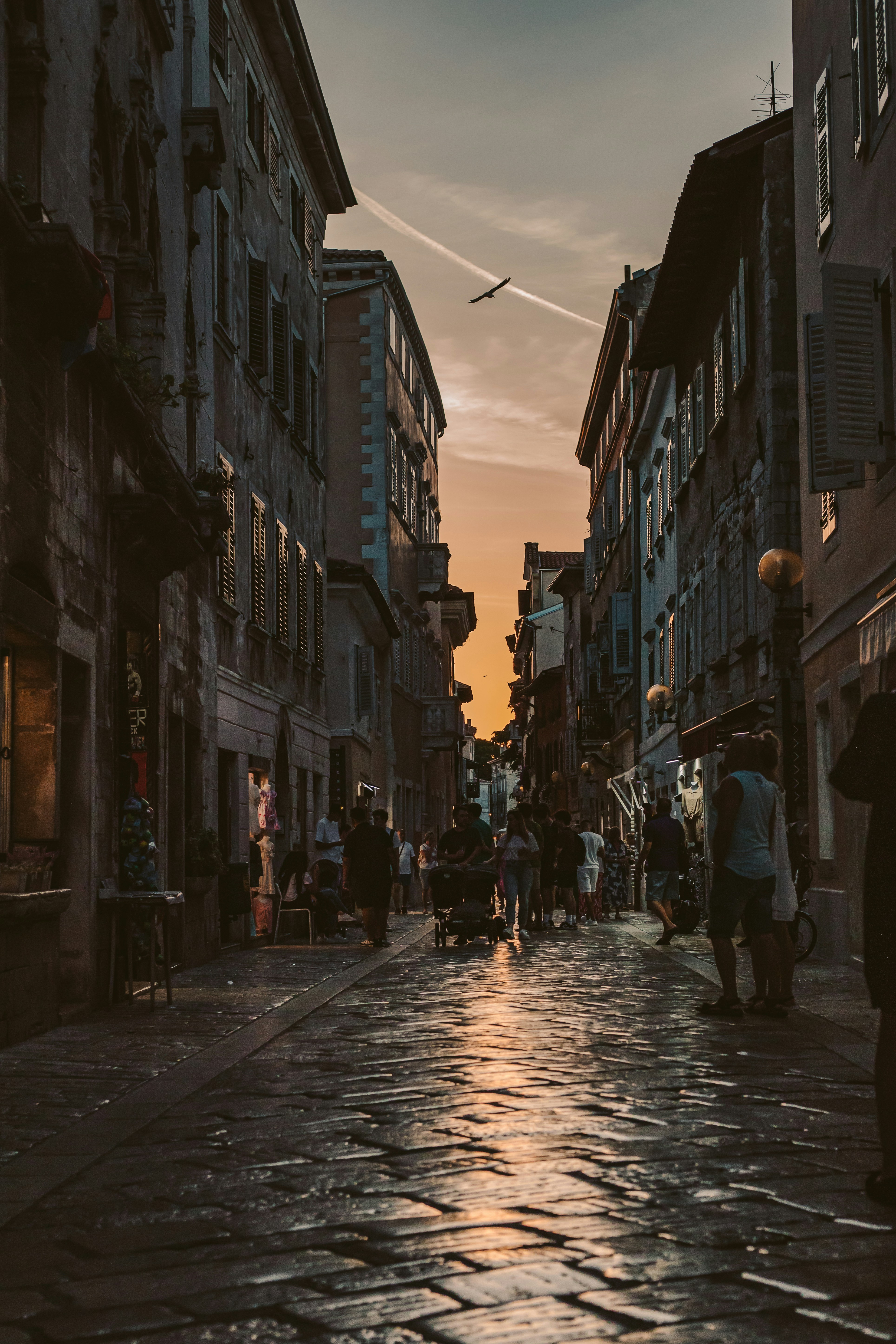 Amber Alleys: Sunset Walk Through a Cobblestone Corridor