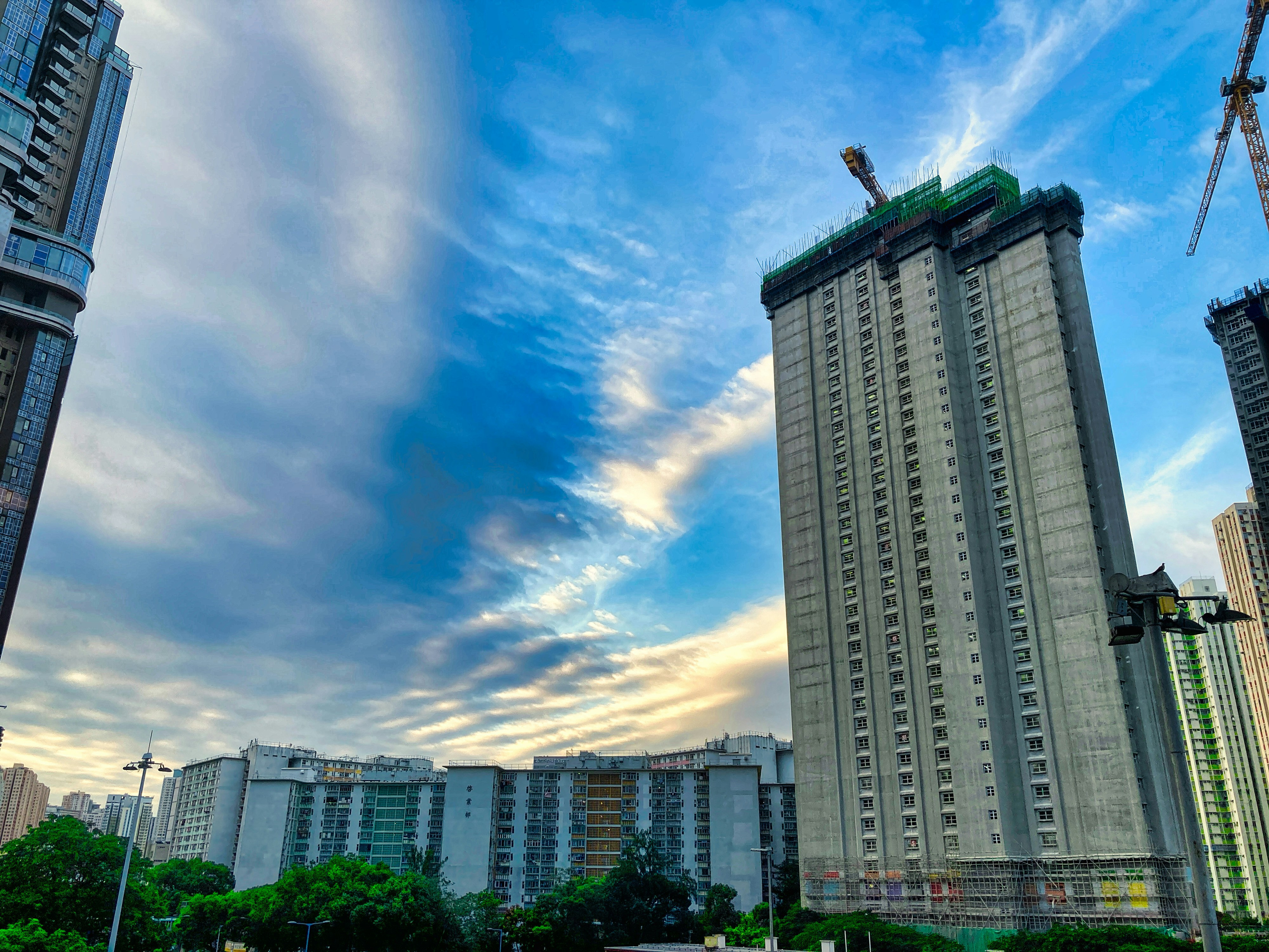 A couple of tall buildings sitting next to each other photo – Free ...