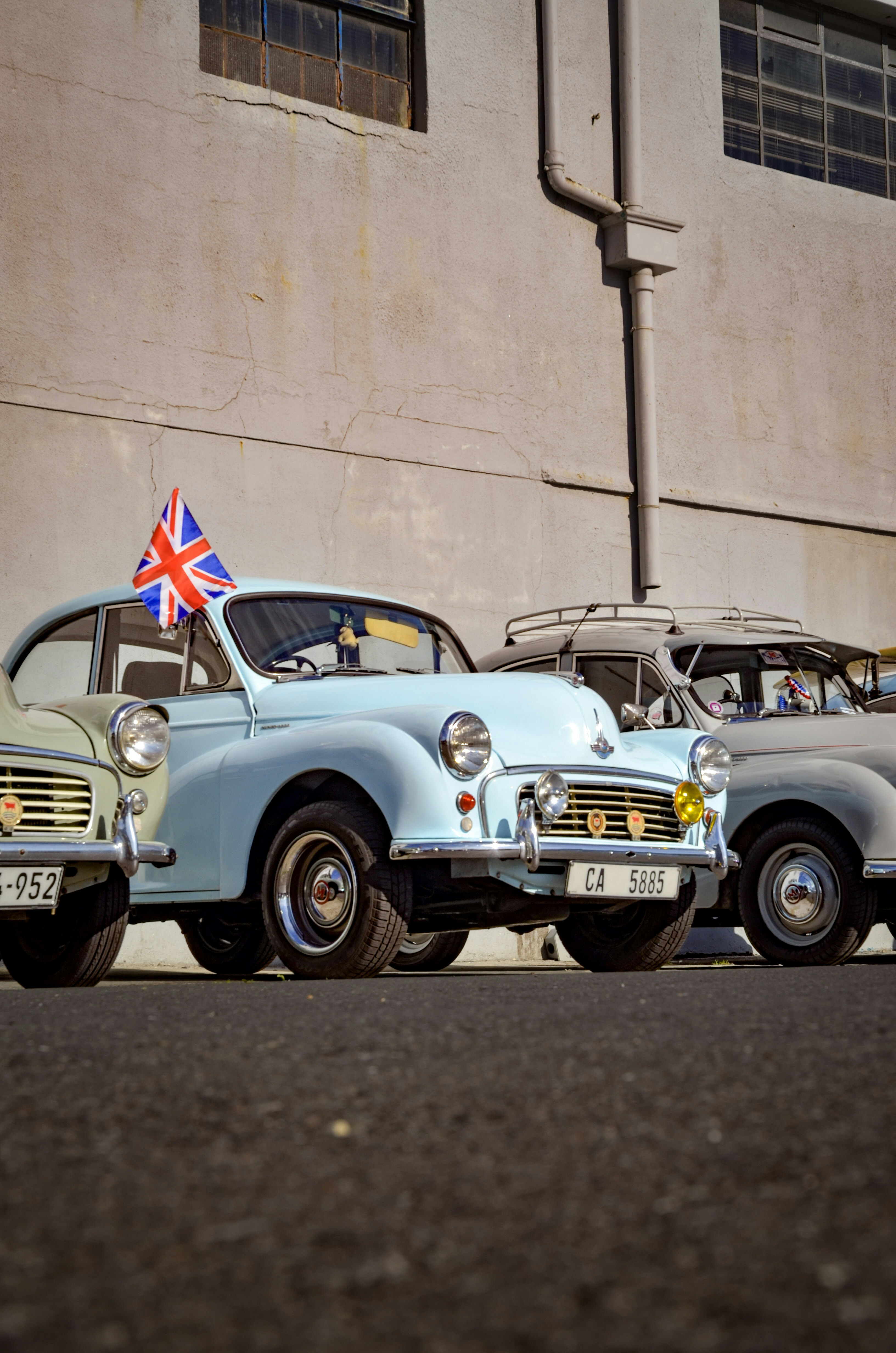 Union Jack on Sky-Blue Classic: A Quiet Parade of Vintage Cars