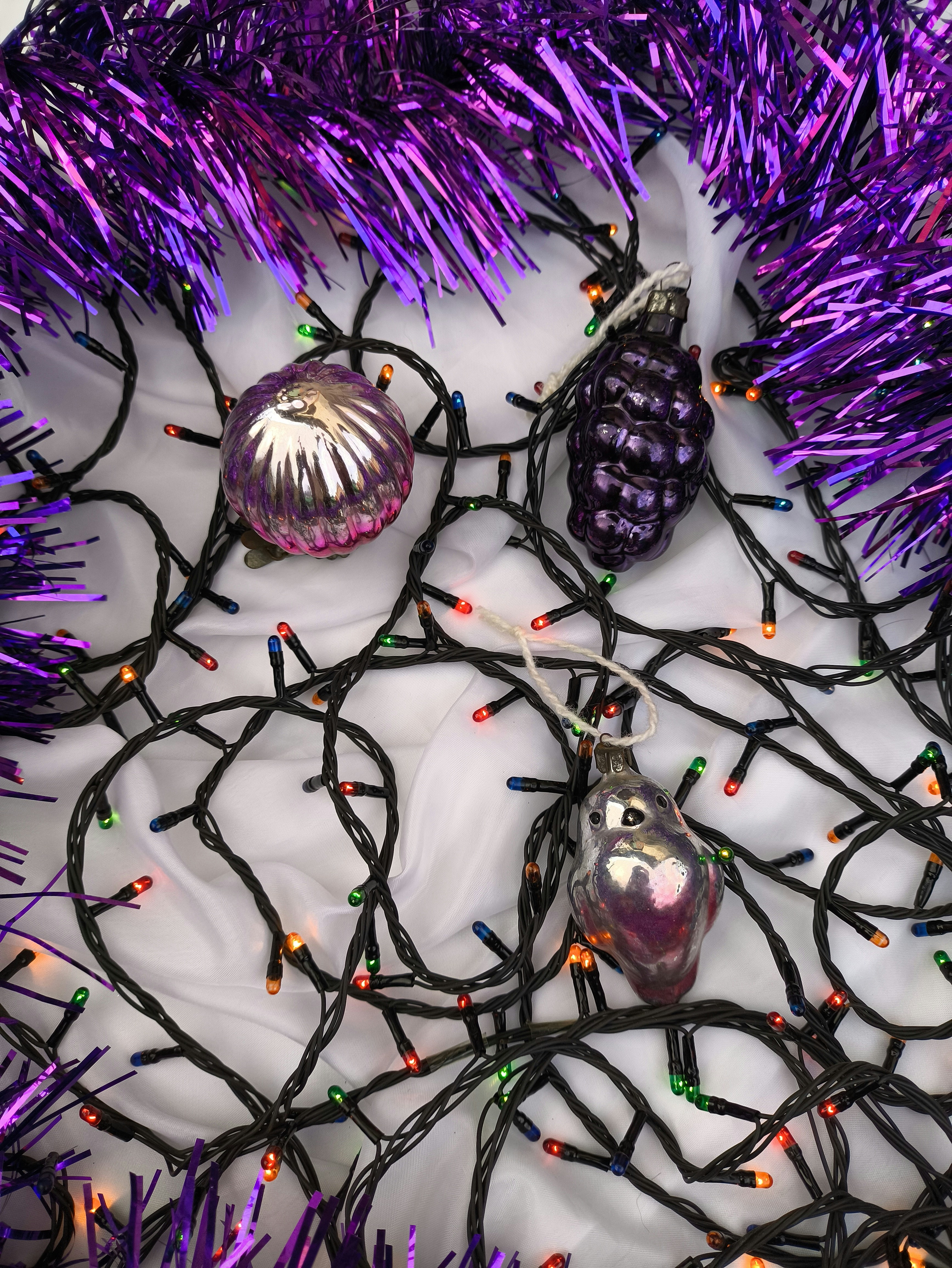Entangled Glow: Close-Up of Neon Lights and Ornament Orbs