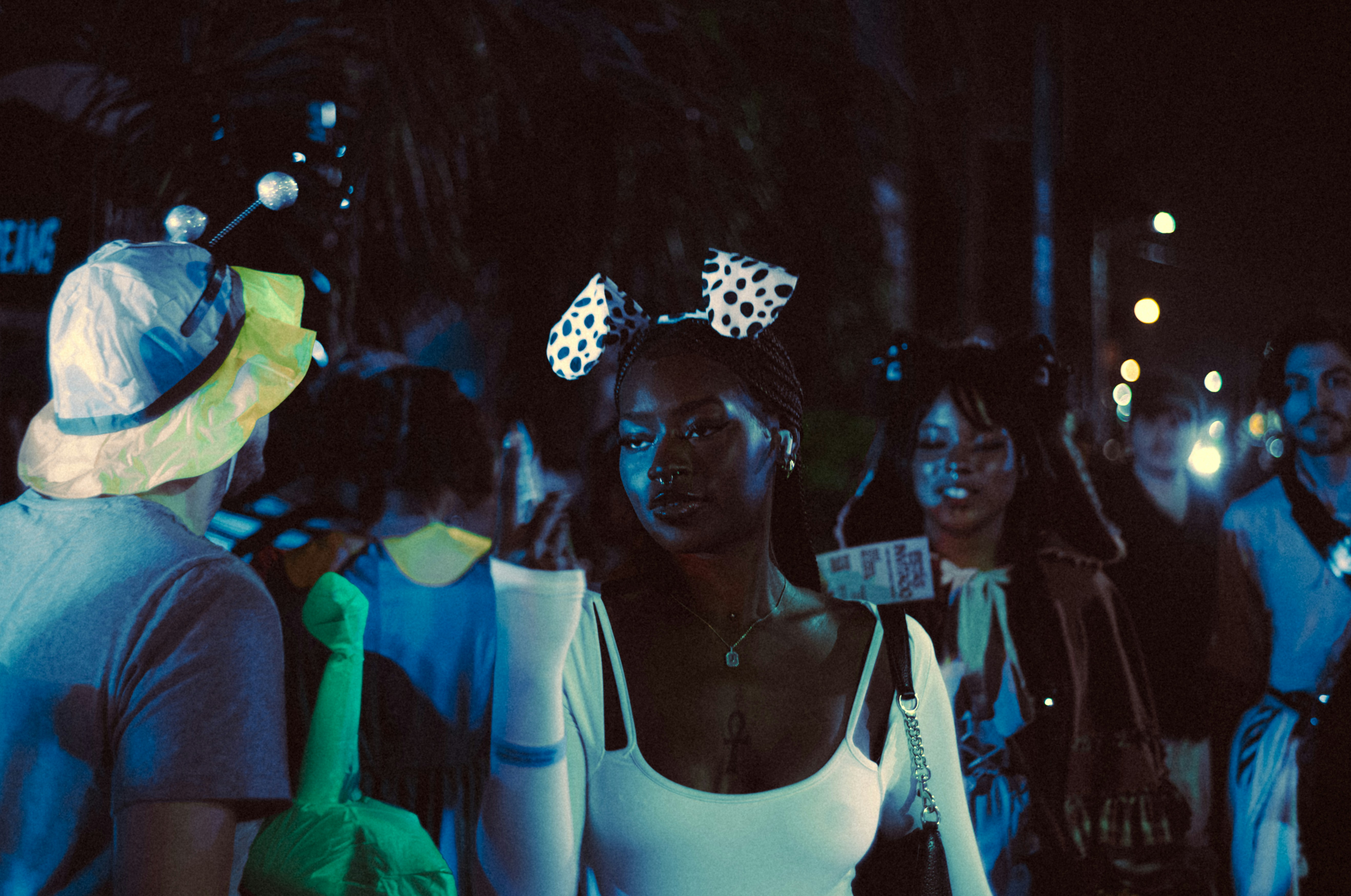 Midnight Carnival: A Neon-Cooled Portrait in the Crowd