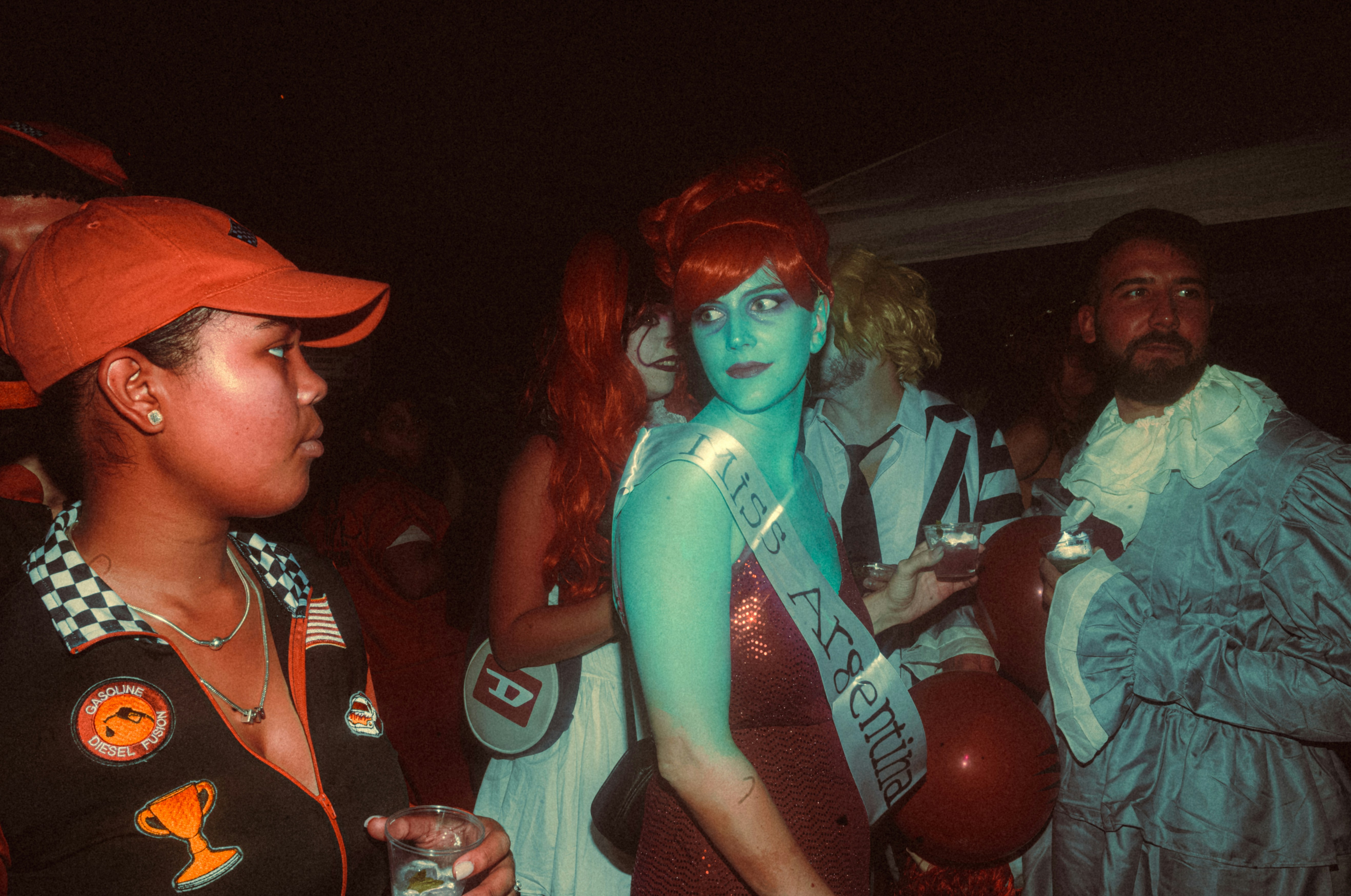 Midnight Masquerade: a teal glow on a masked moment