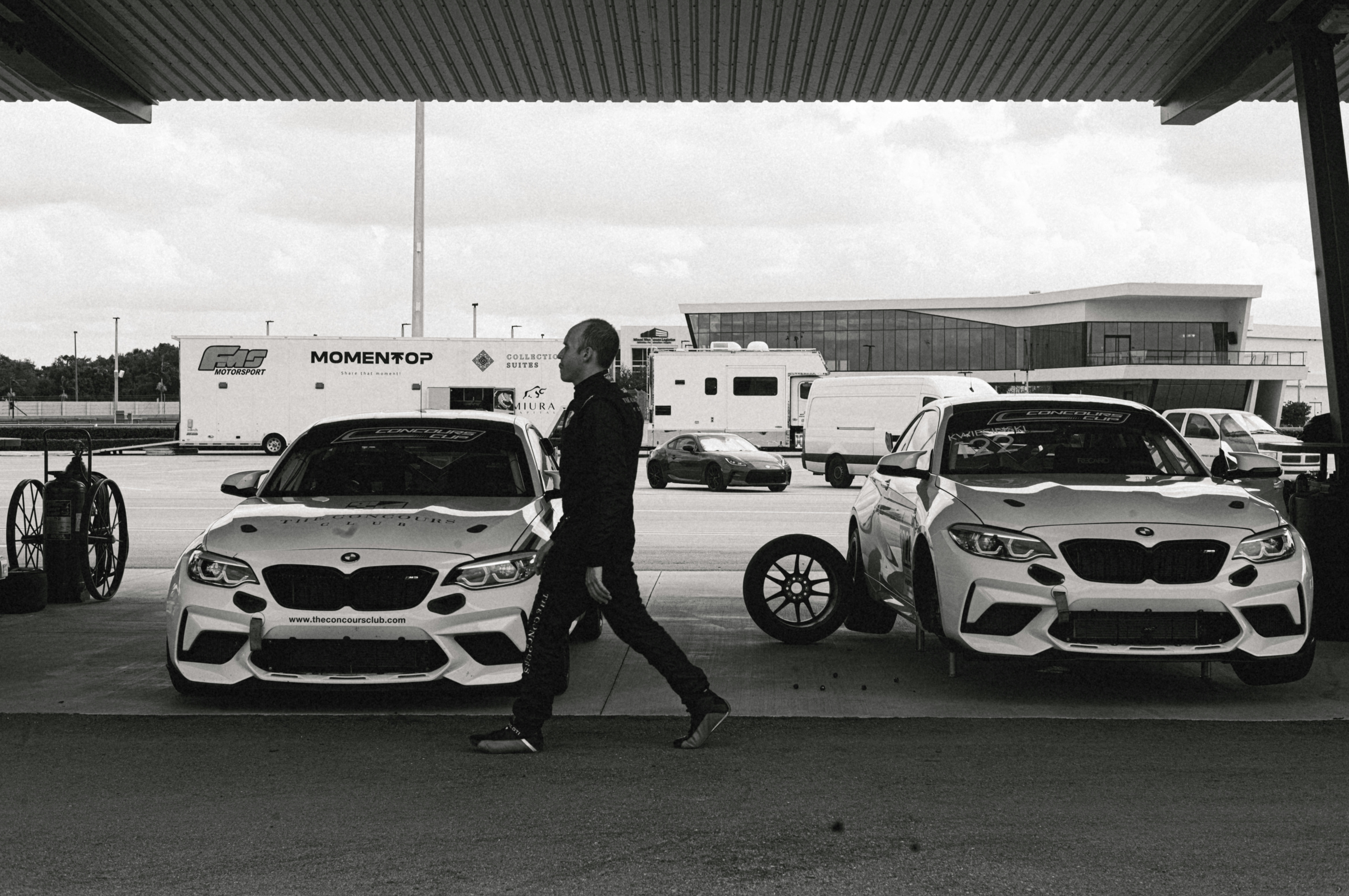 Silhouetted stride between two performance machines