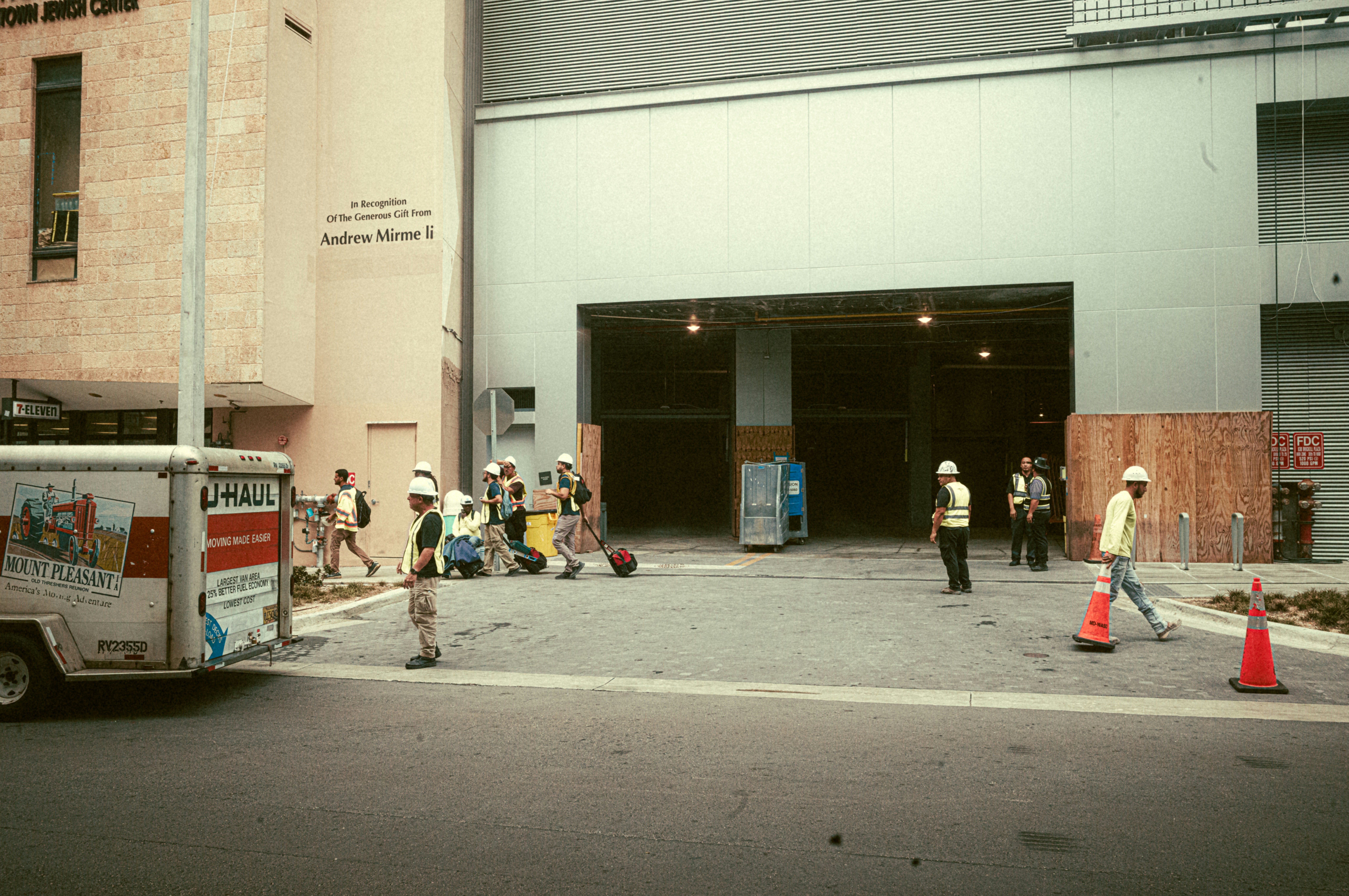 A group of people standing outside of a building photo – Free Building ...