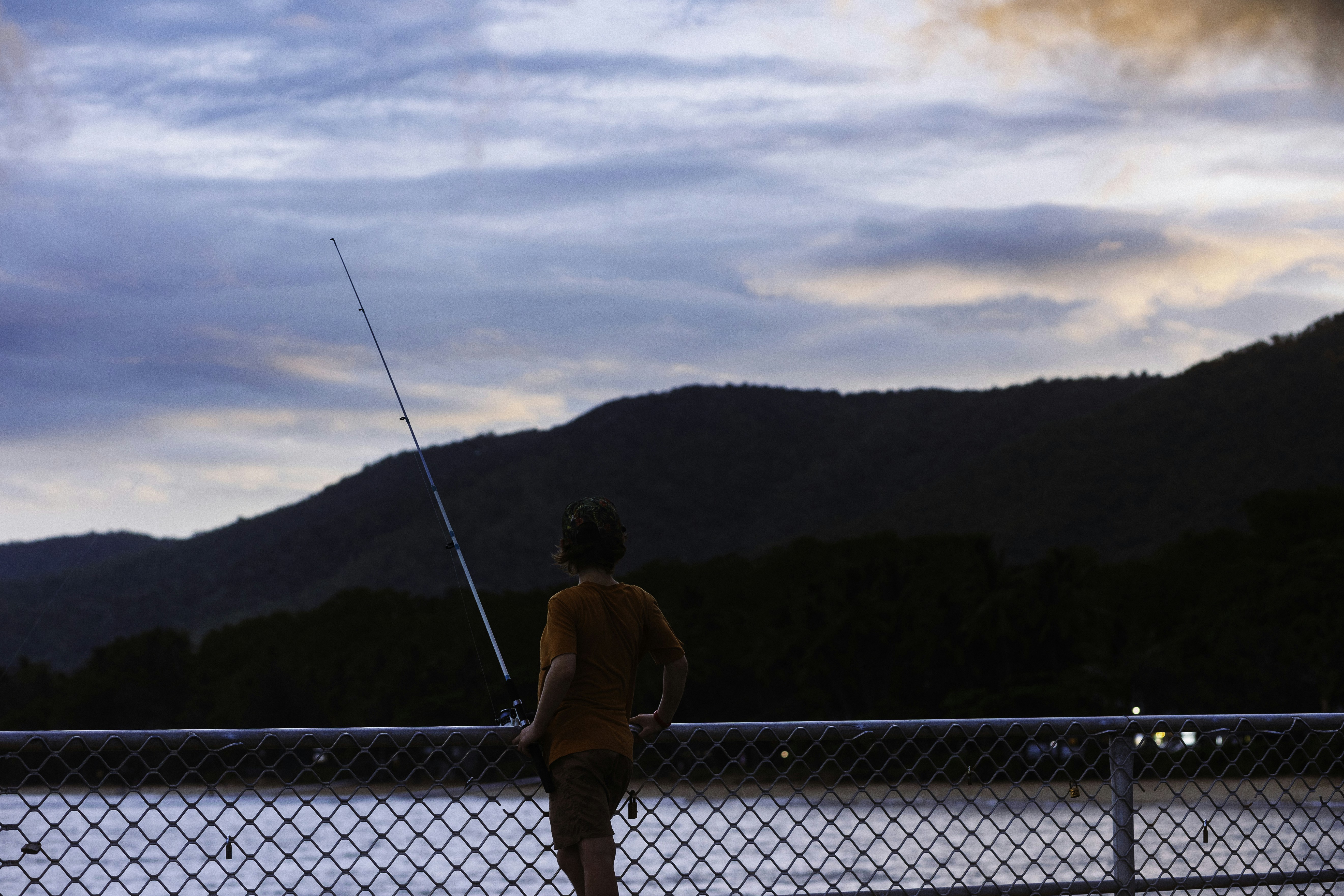 Fisherman at the Fence: Dusk by the Water