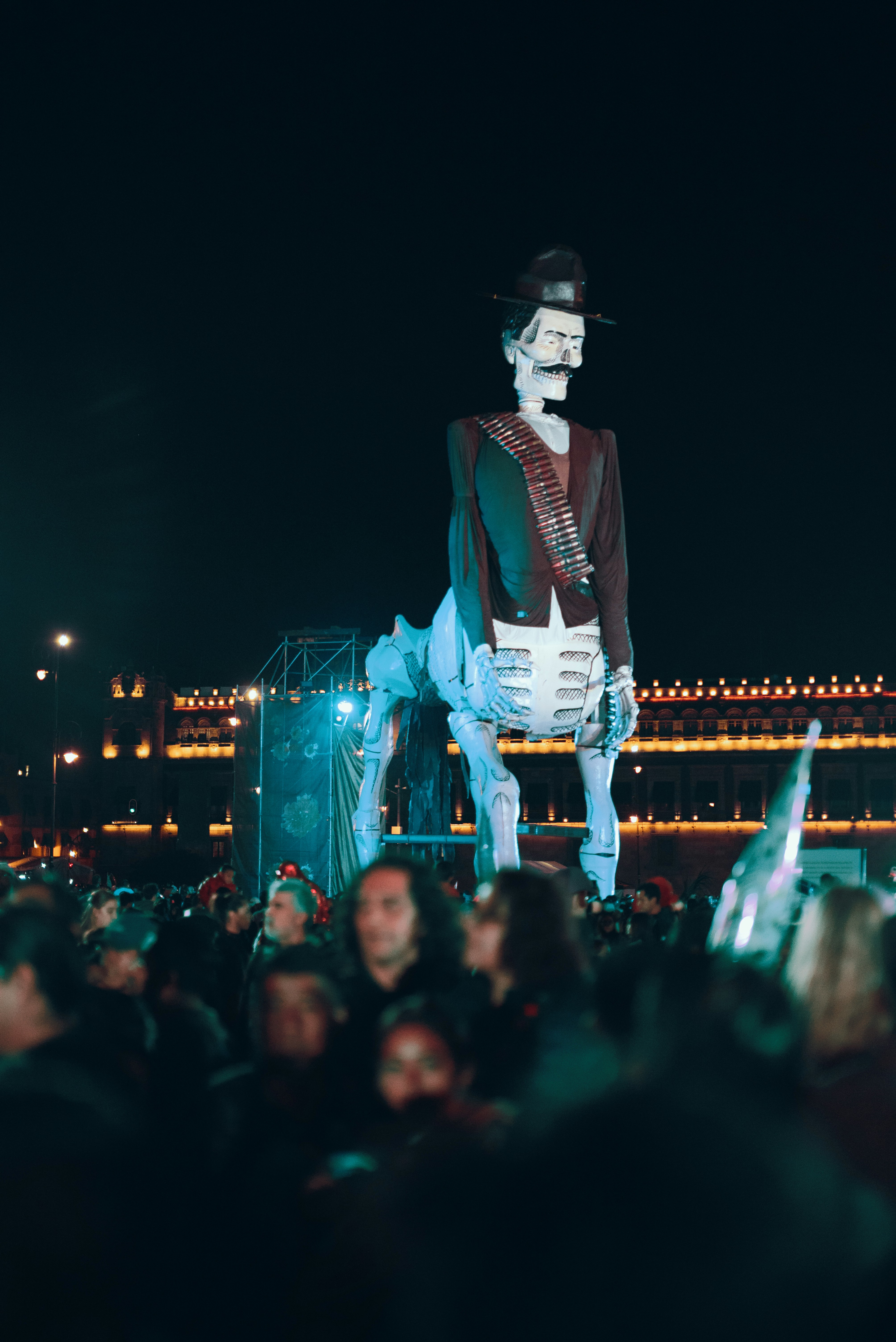 Neon Nightwatch: The Giant Skeleton Reigns Over the Festival Square