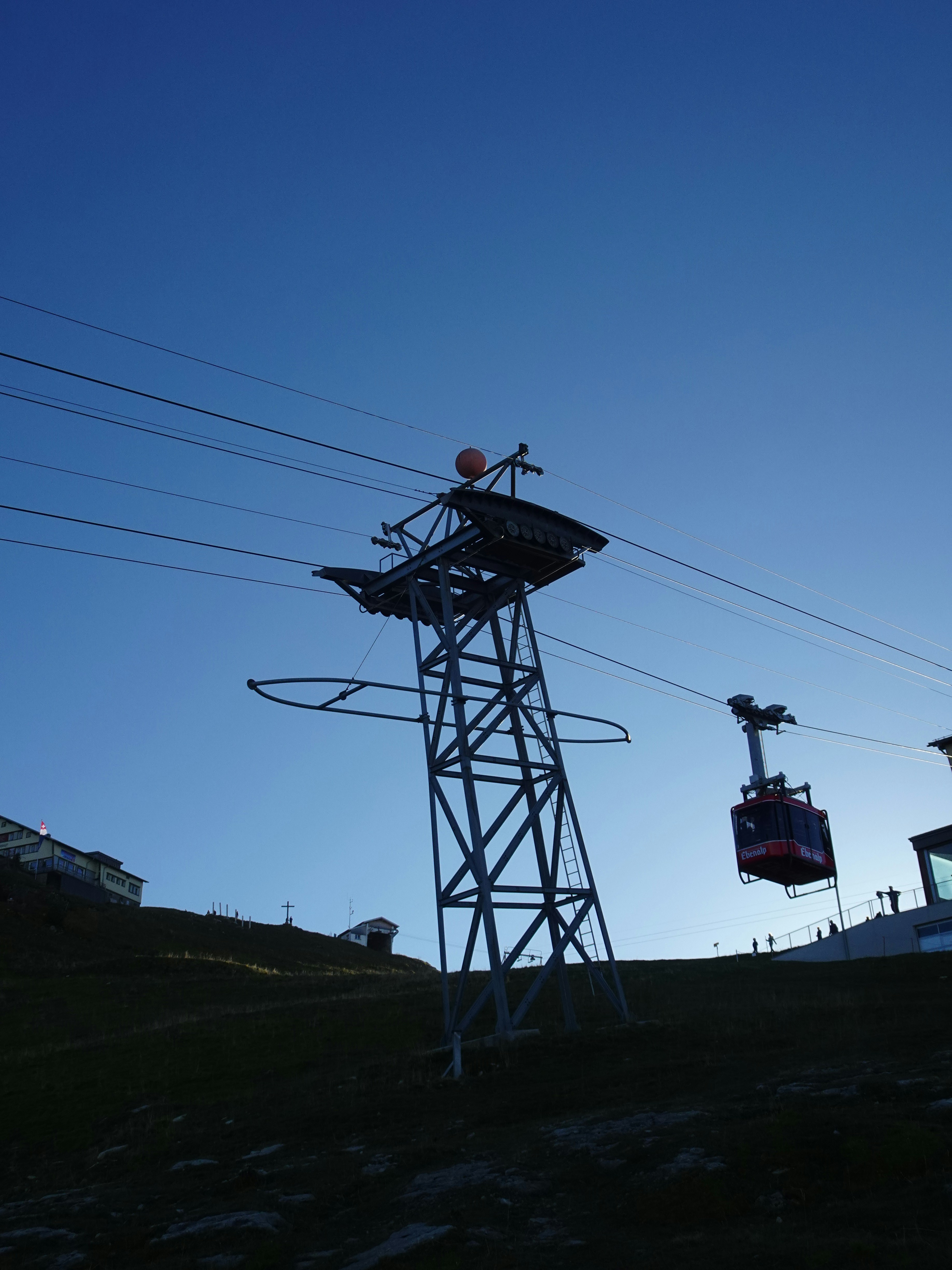 Steel Lattice Sentinel Against a Cerulean Alpine Sky