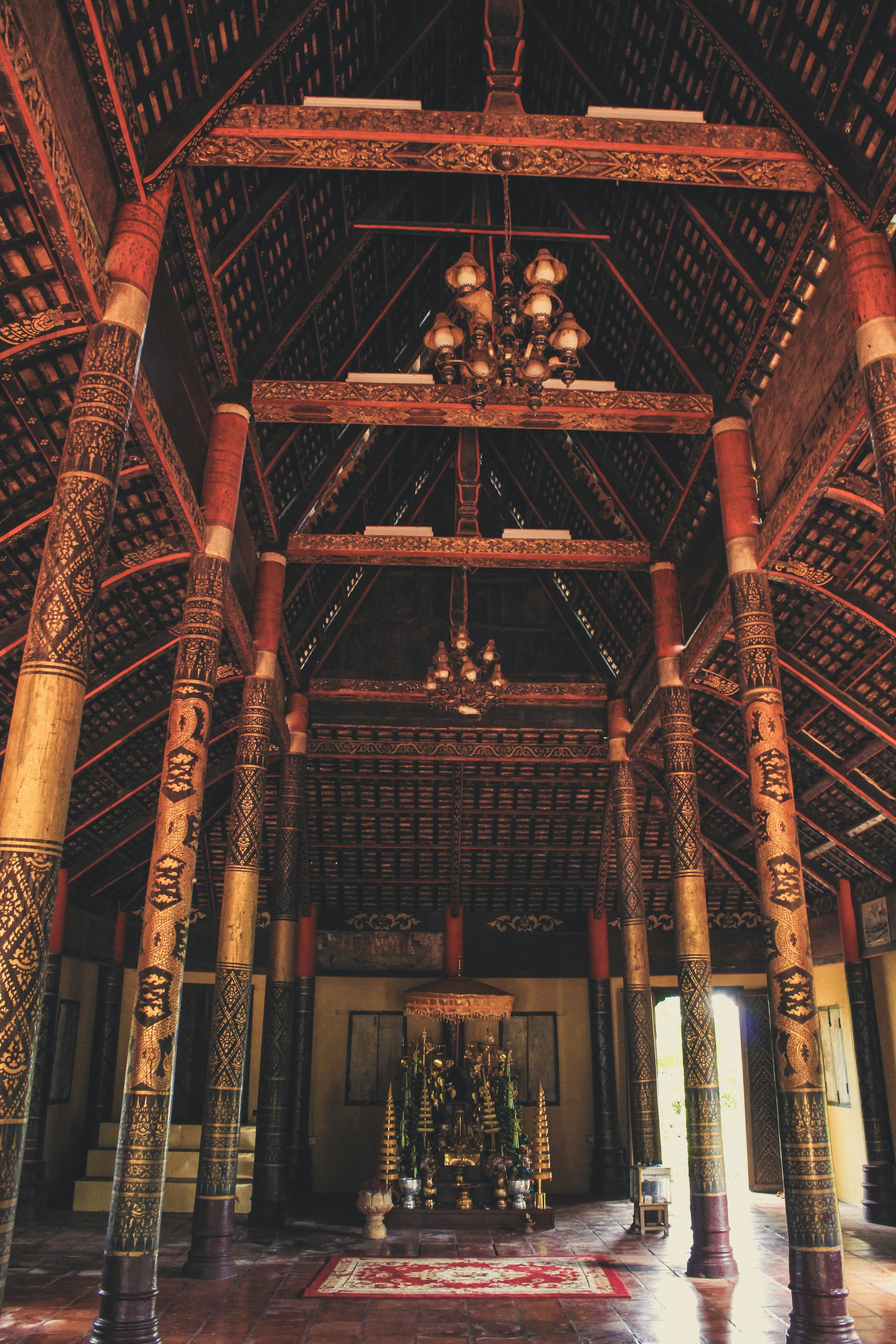 Echoes of the Lanterned Hall: A Sacred Interior Amid Ornate Columns