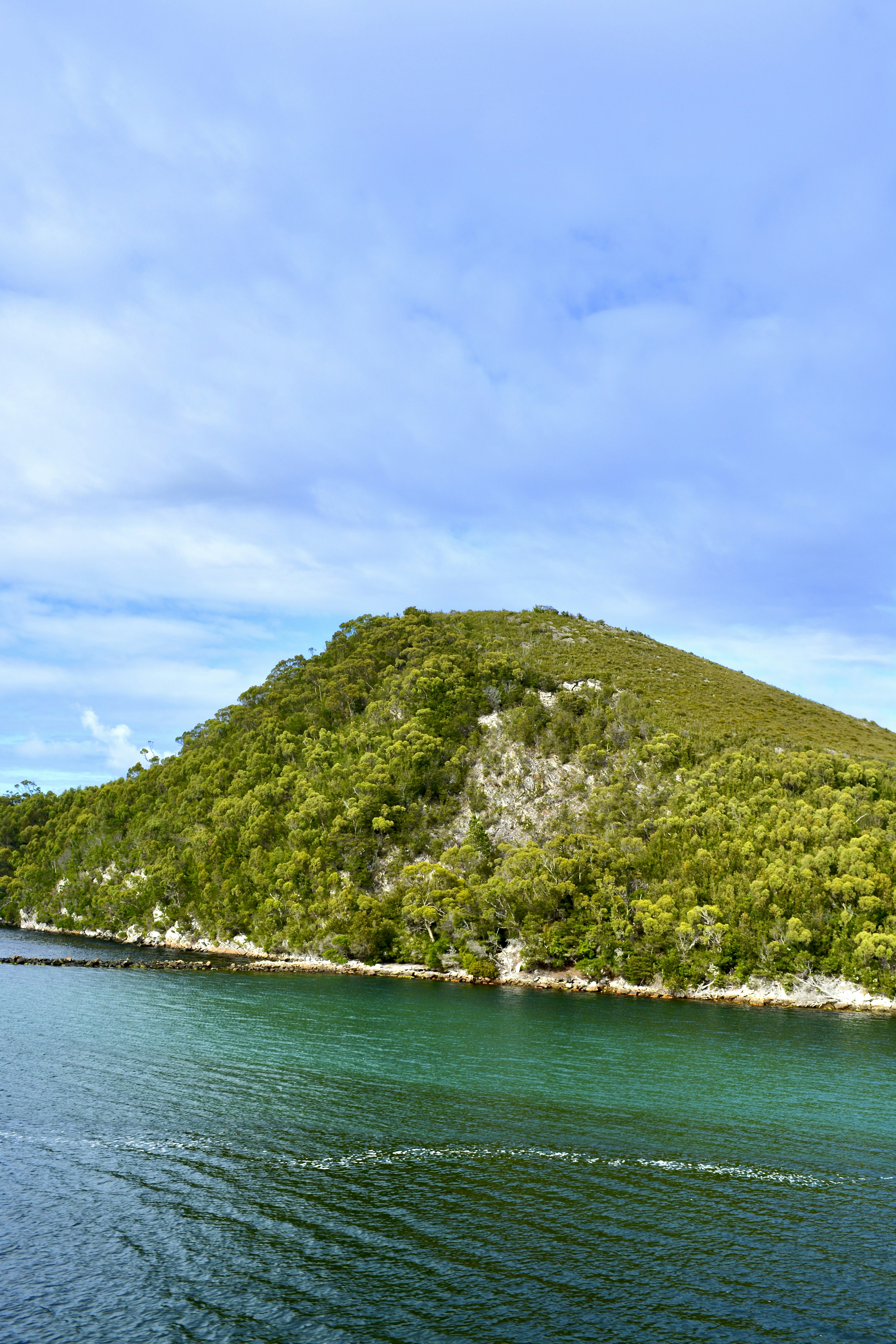 A small island in the middle of a body of water photo – Free Macquarie ...