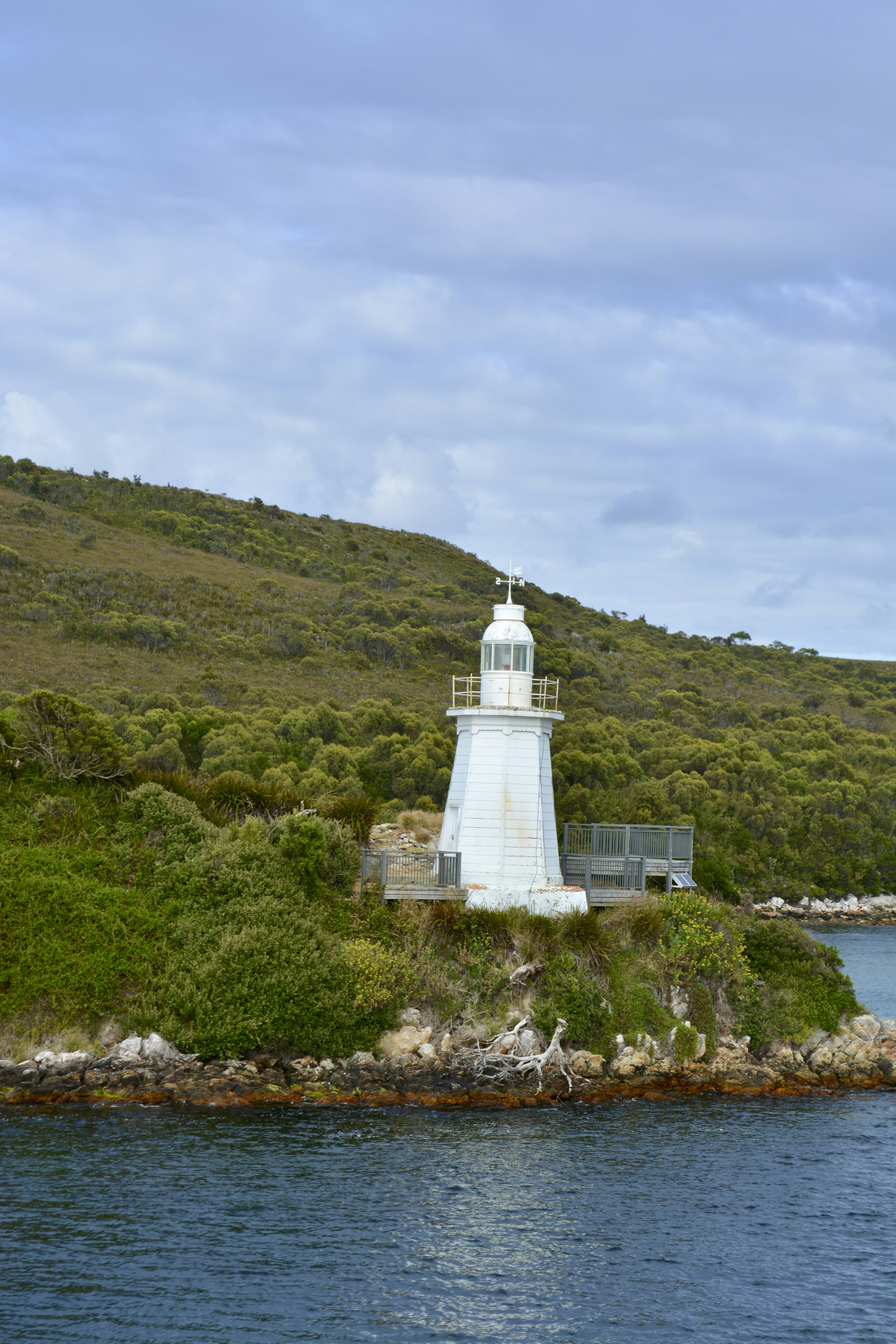 Verdant Cape Lighthouse: A Seaside Sentinel