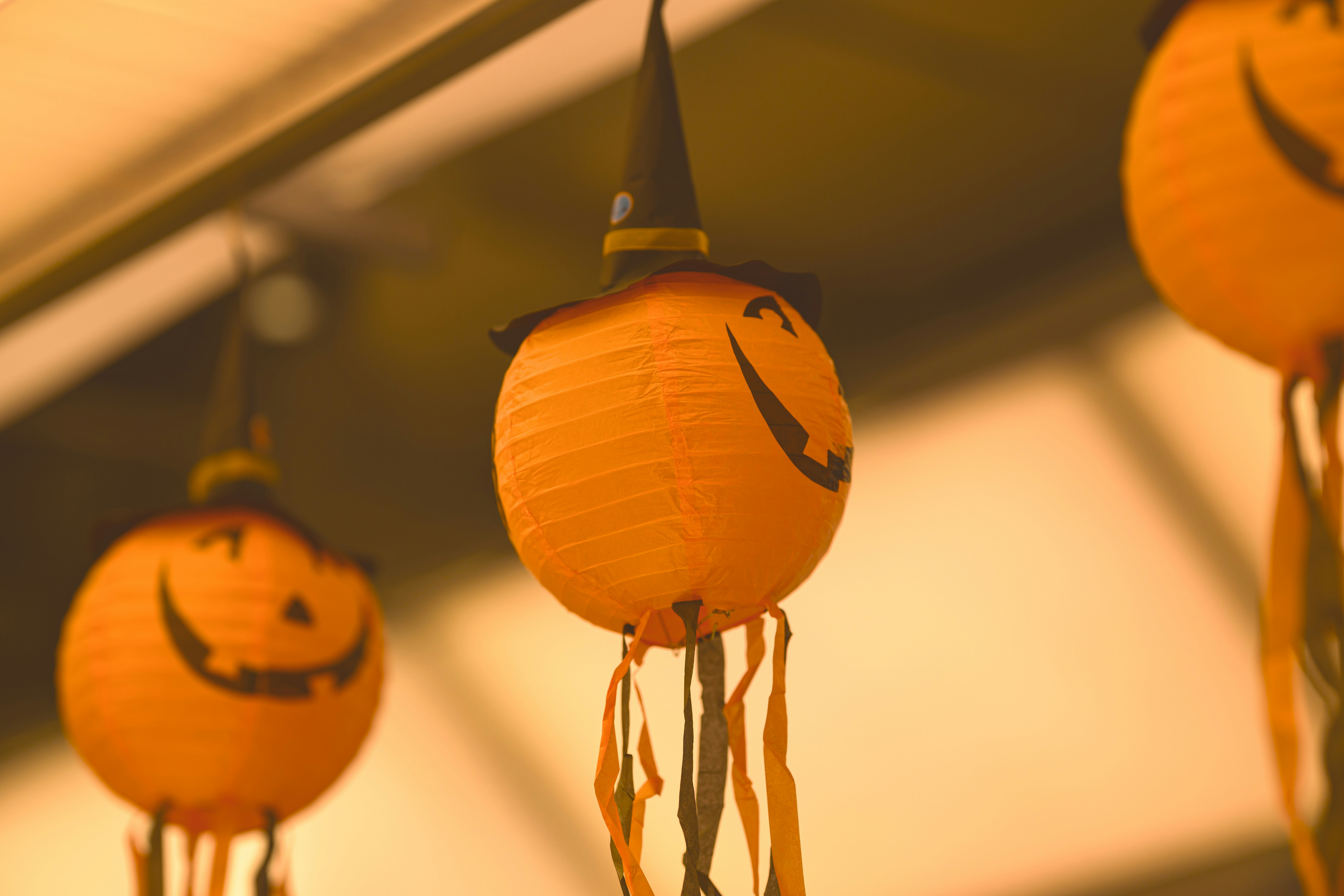 Amber Halloween Lanterns in a Soft, Glowing Blur