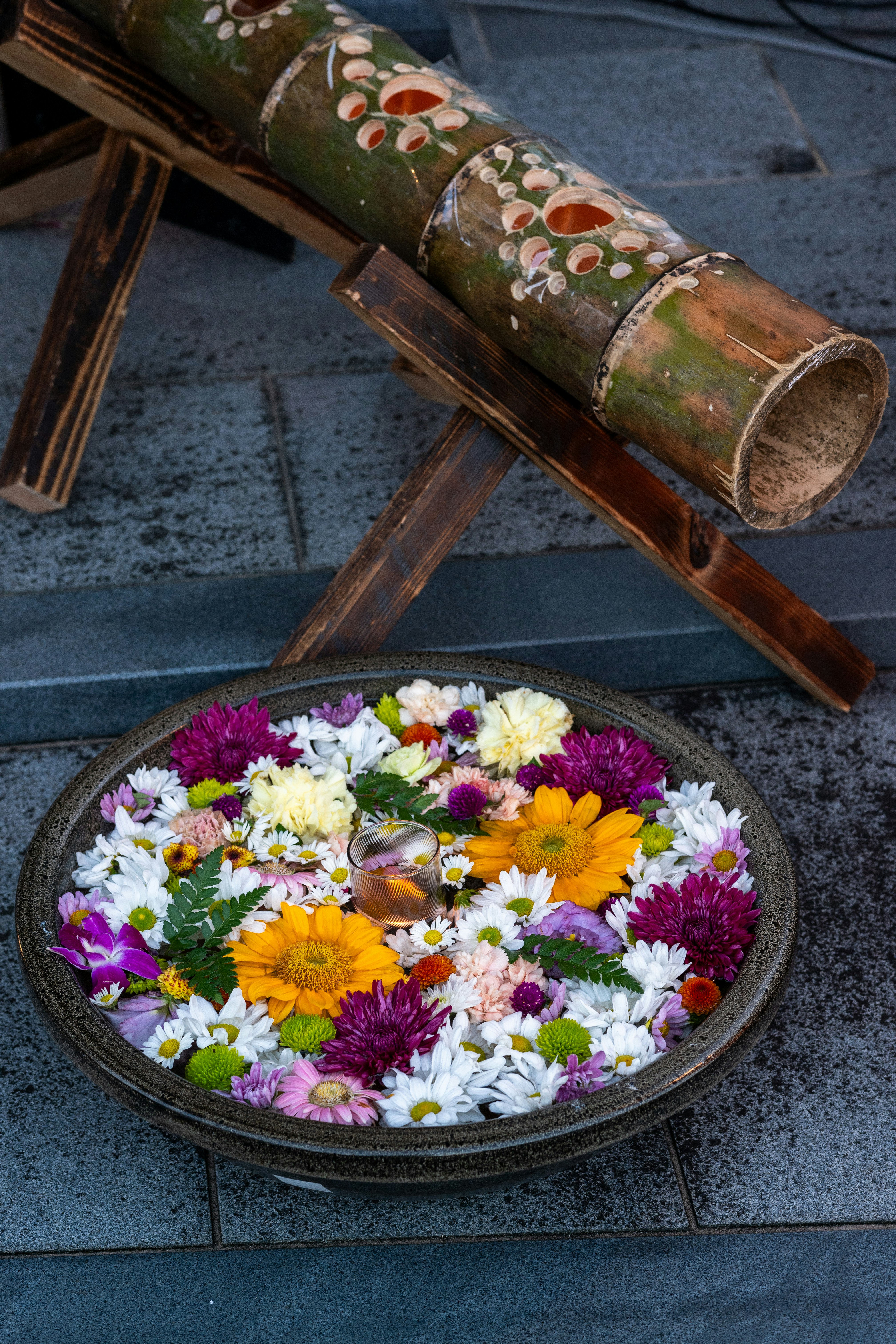 A bunch of flowers that are in a bowl