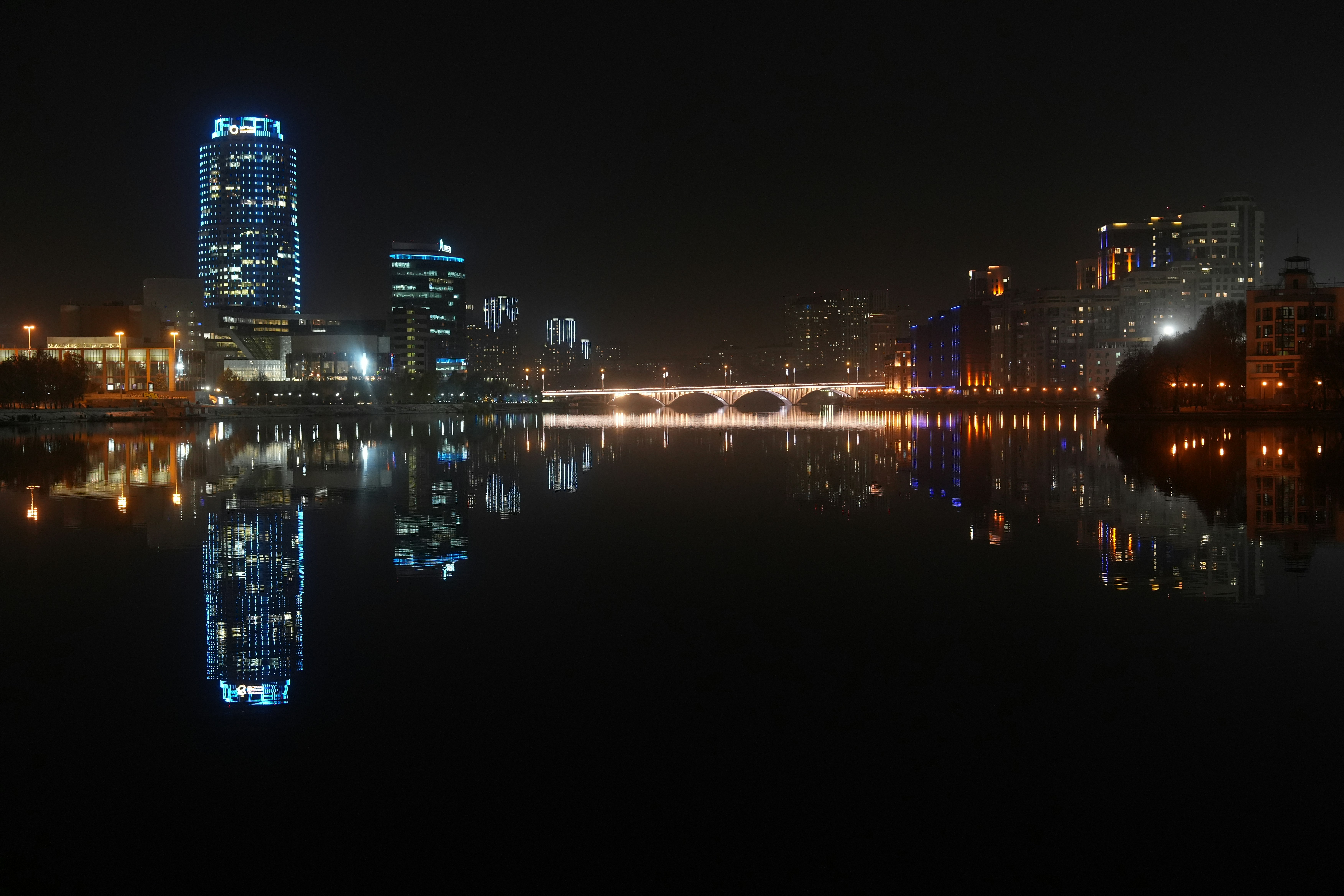 Neon Reverie by the River: Midnight Cityscape