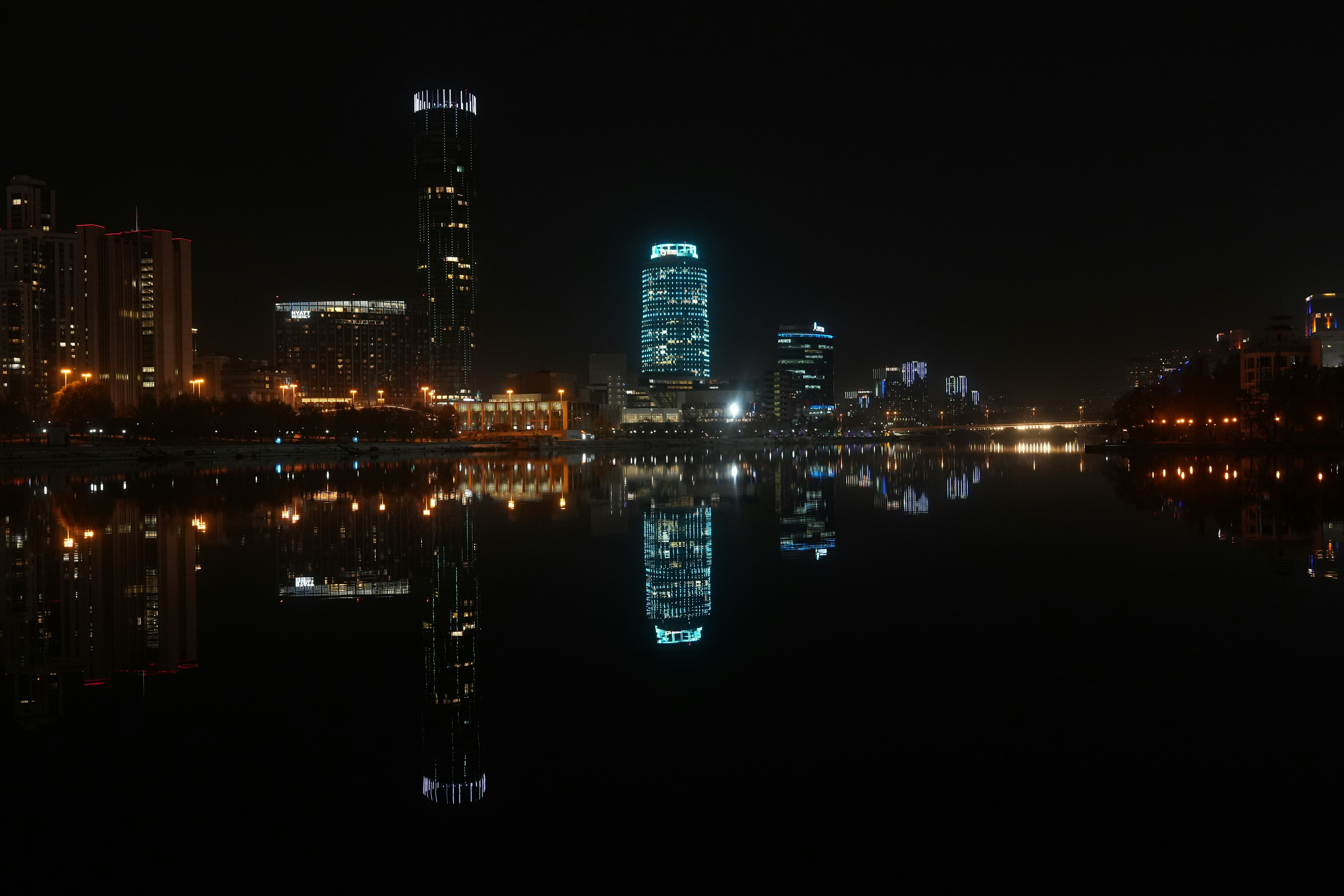 Blue-Topped Beacon over a Glassy Harbor