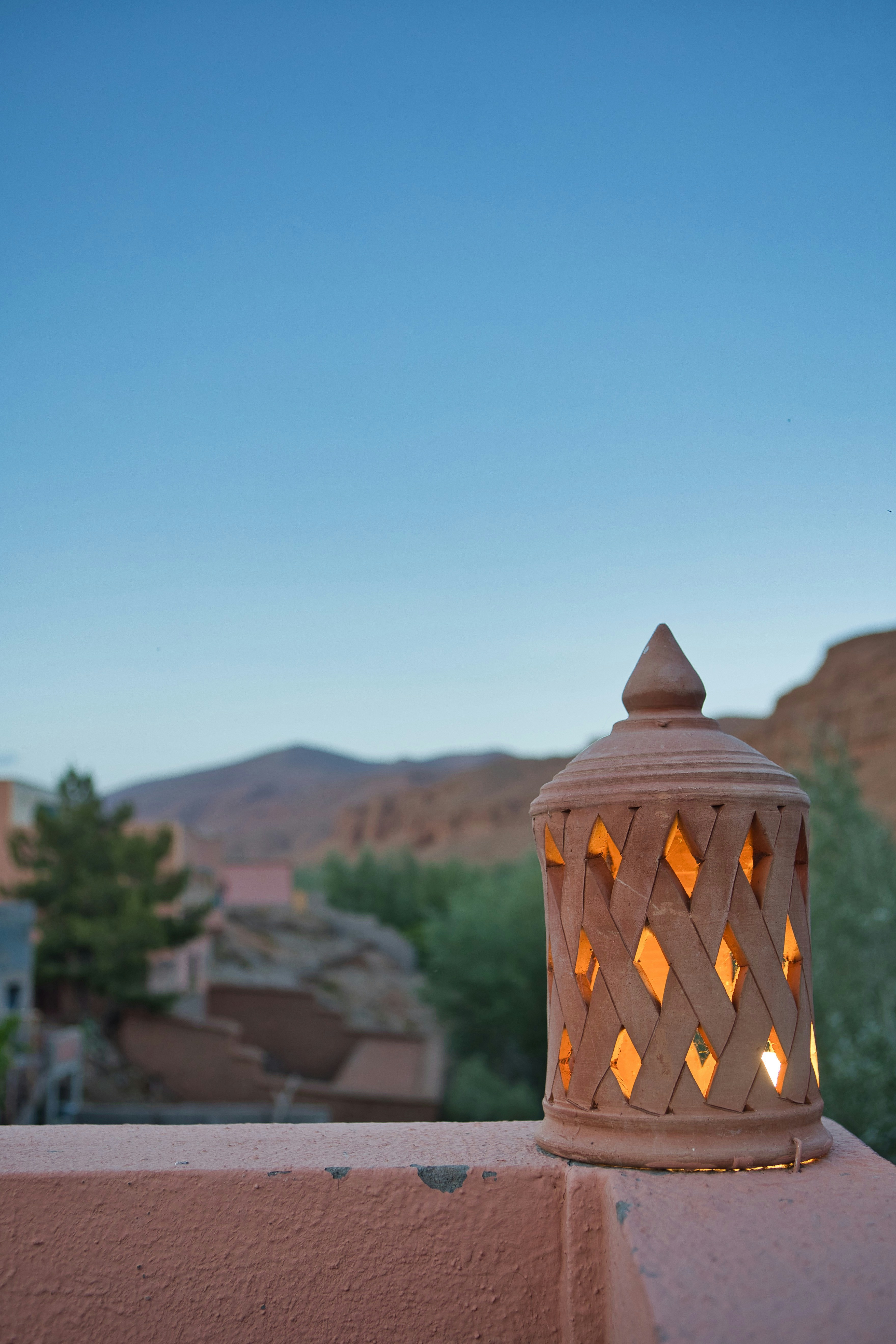 Lattice Lantern Glow Framing a Desert Rooftop at Dusk