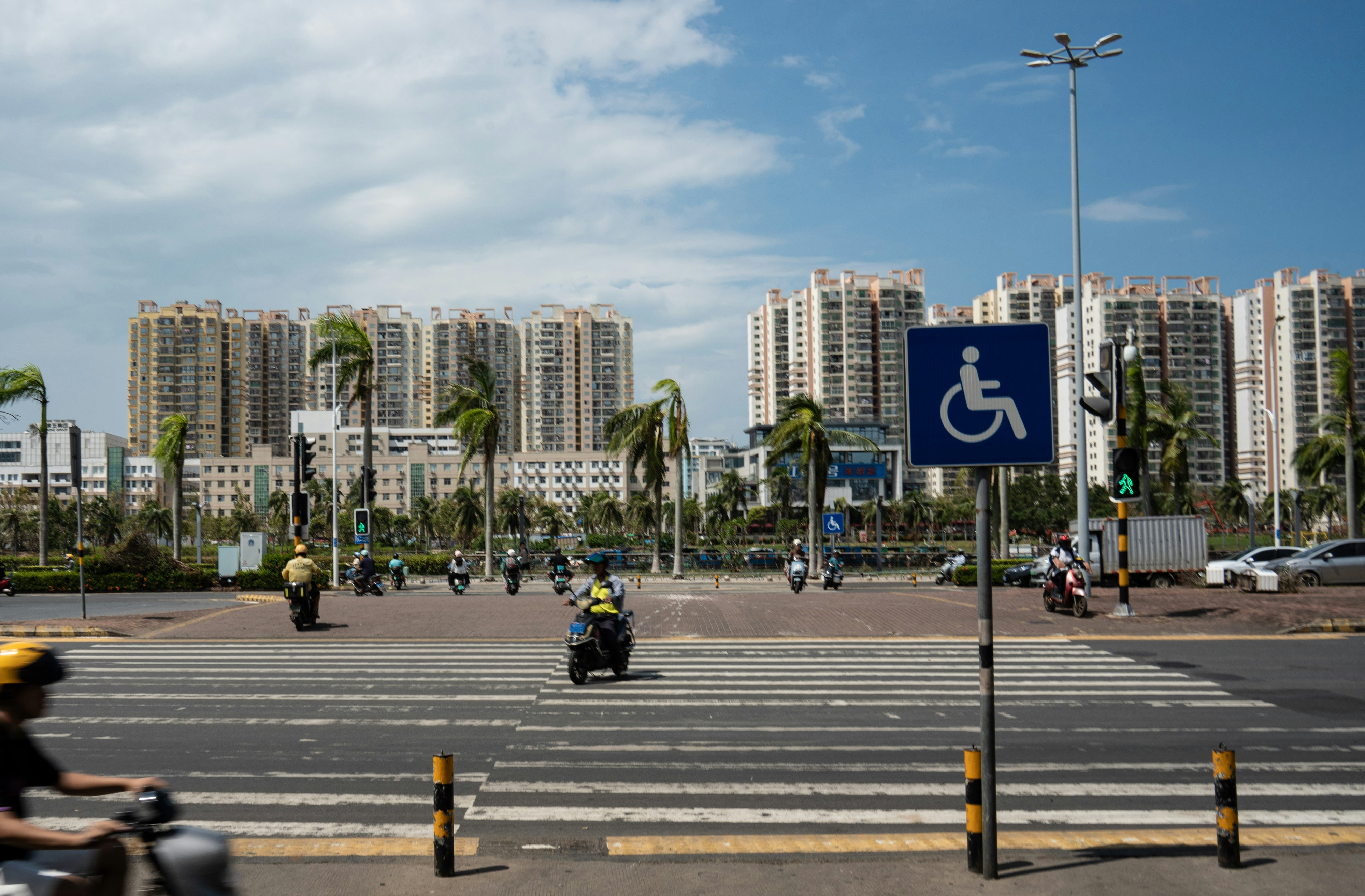 Crossing the City: Pedestrian Sign Under the Line of Towers
