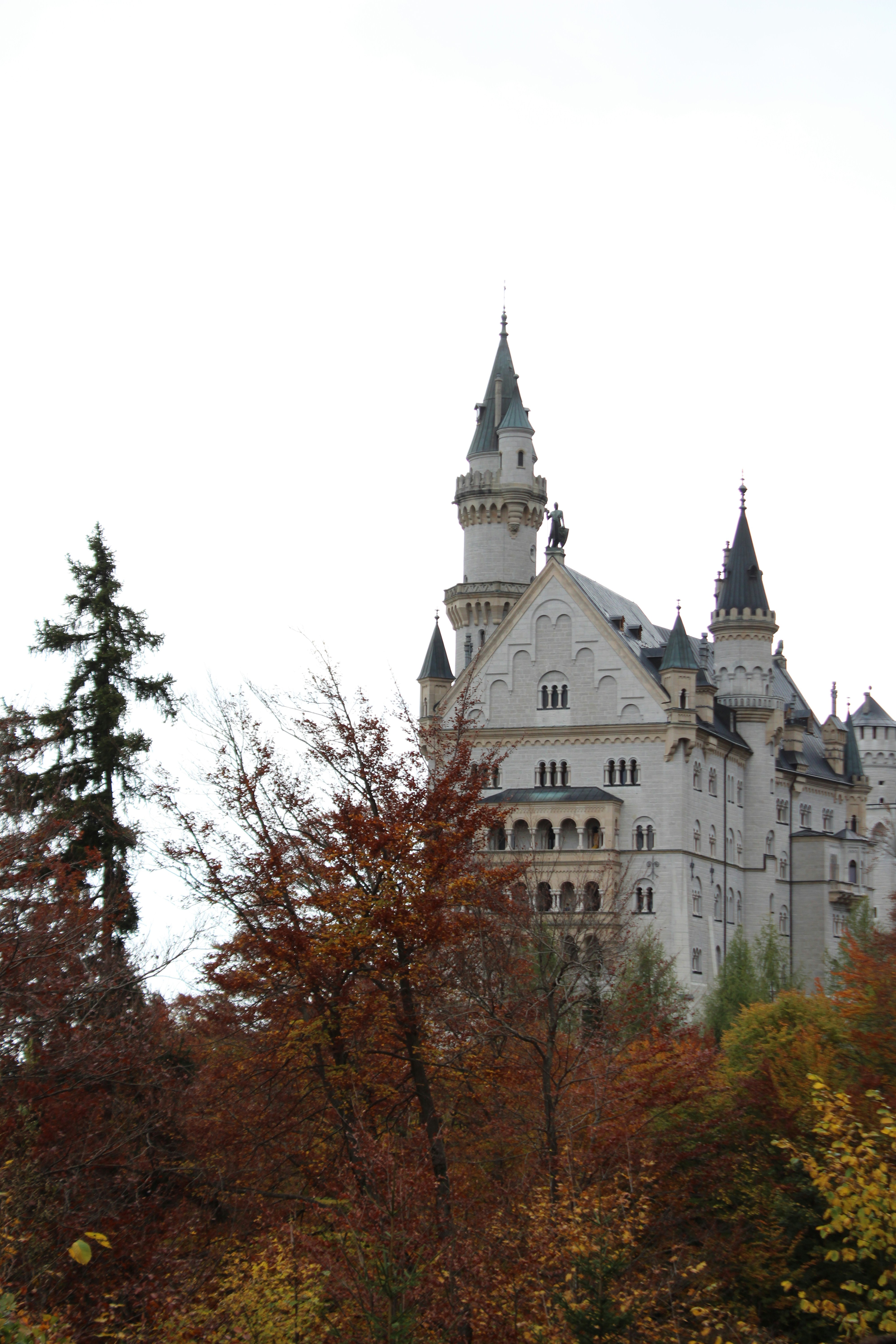 A large white castle with a clock on it's side photo – Free Germany ...