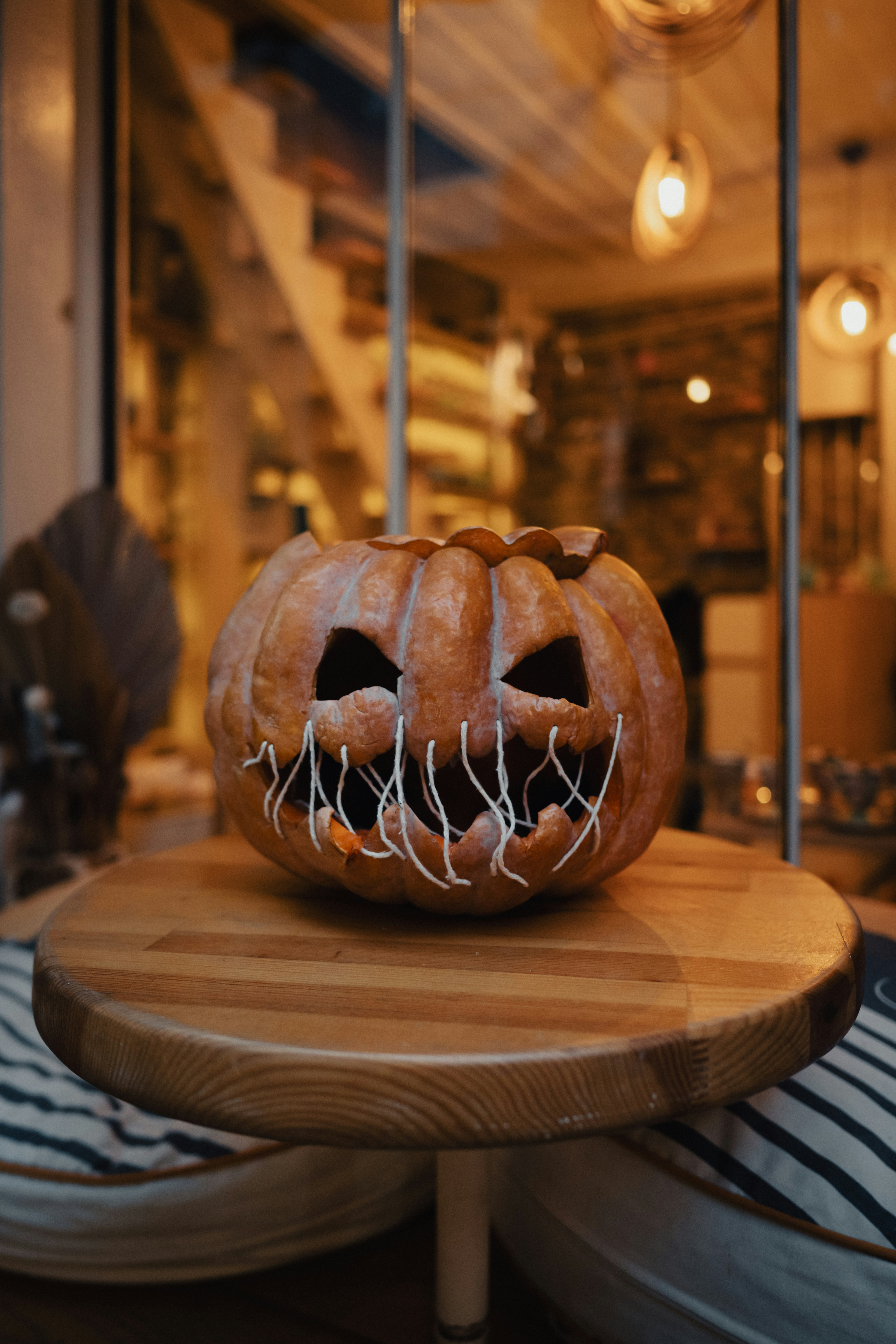 String-Teeth Pumpkin on a Quiet Café Table