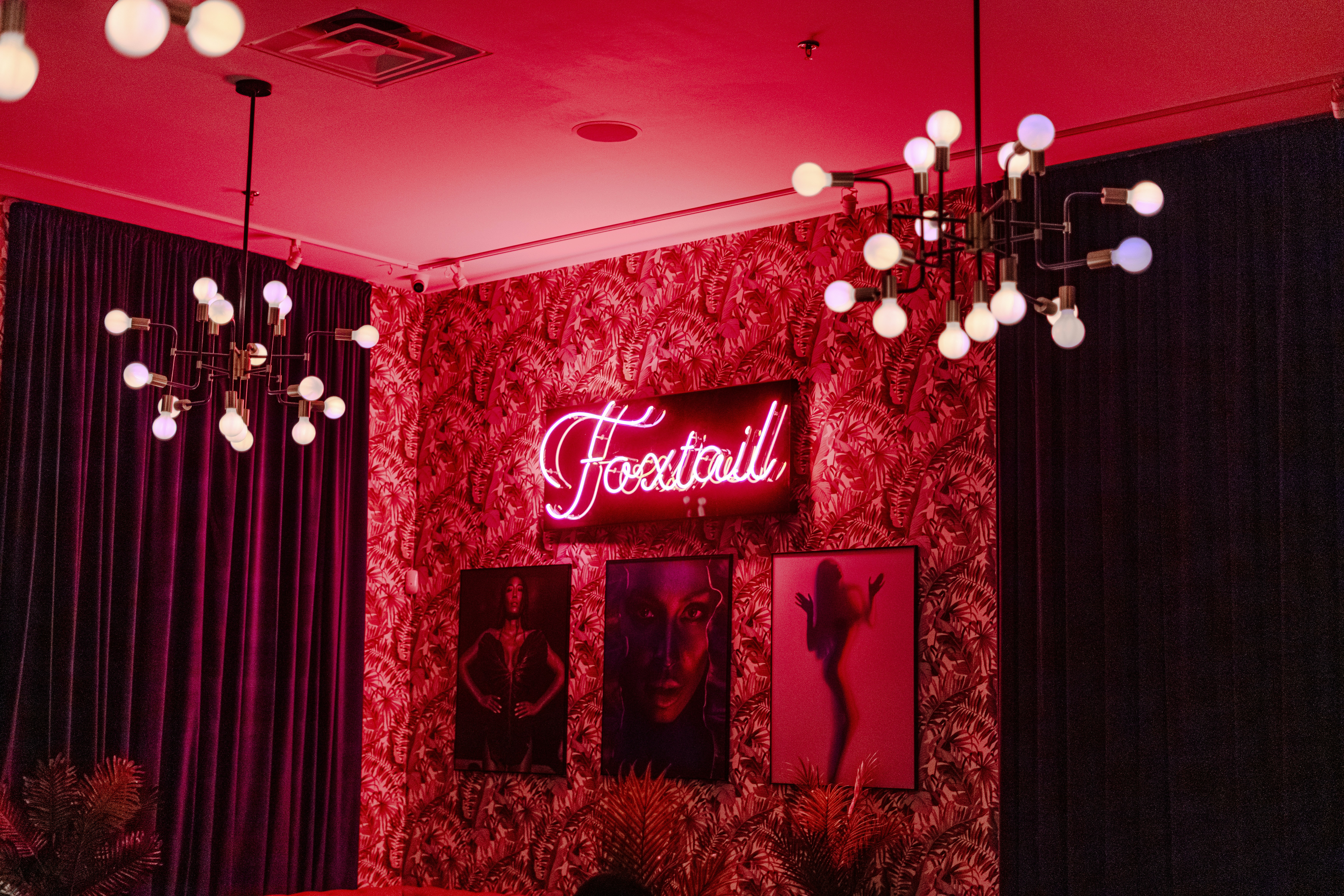 A room with red lighting and a coca cola sign photo – Free Foxtail ...