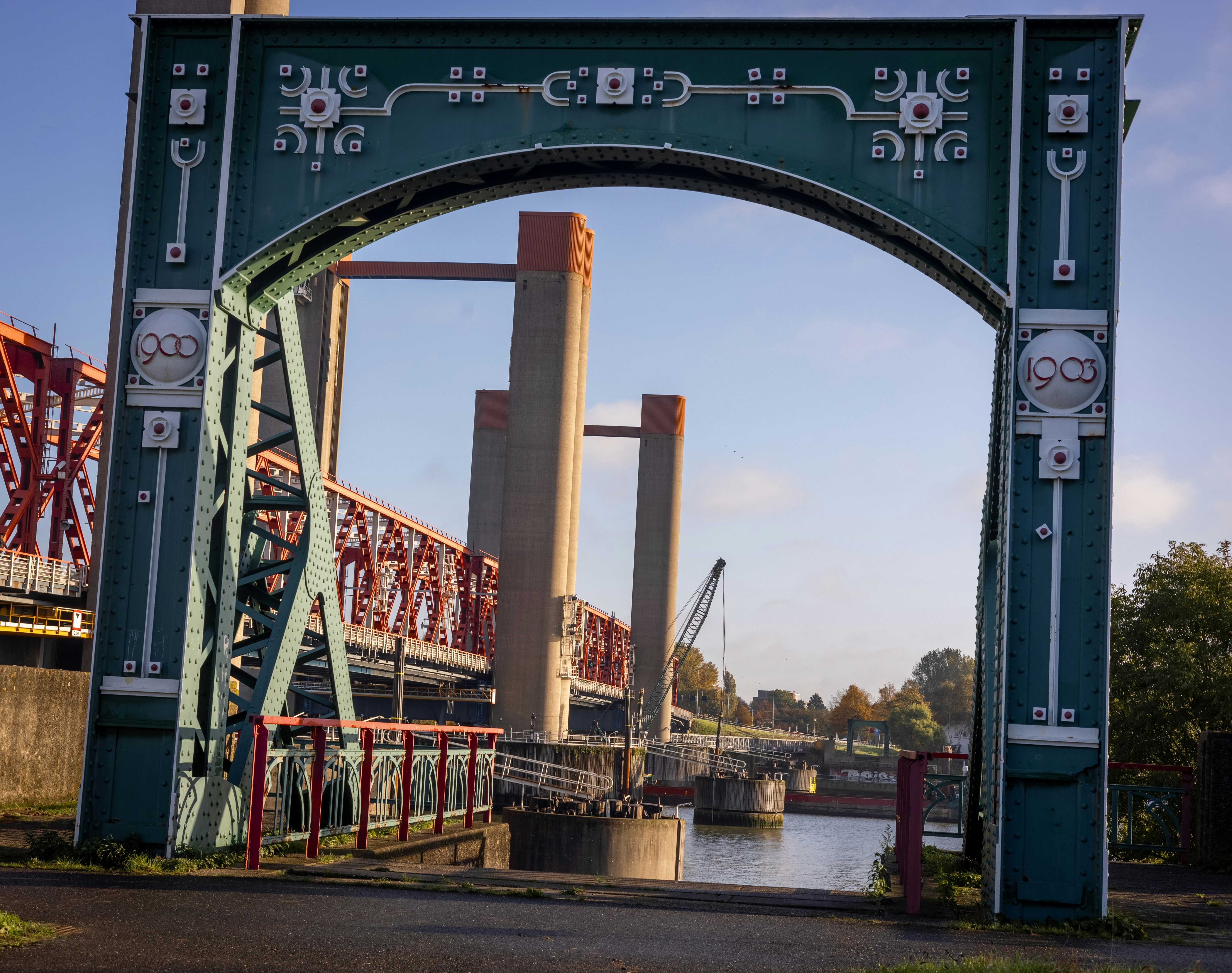 Teal Arch Portal Over the Quiet Canal