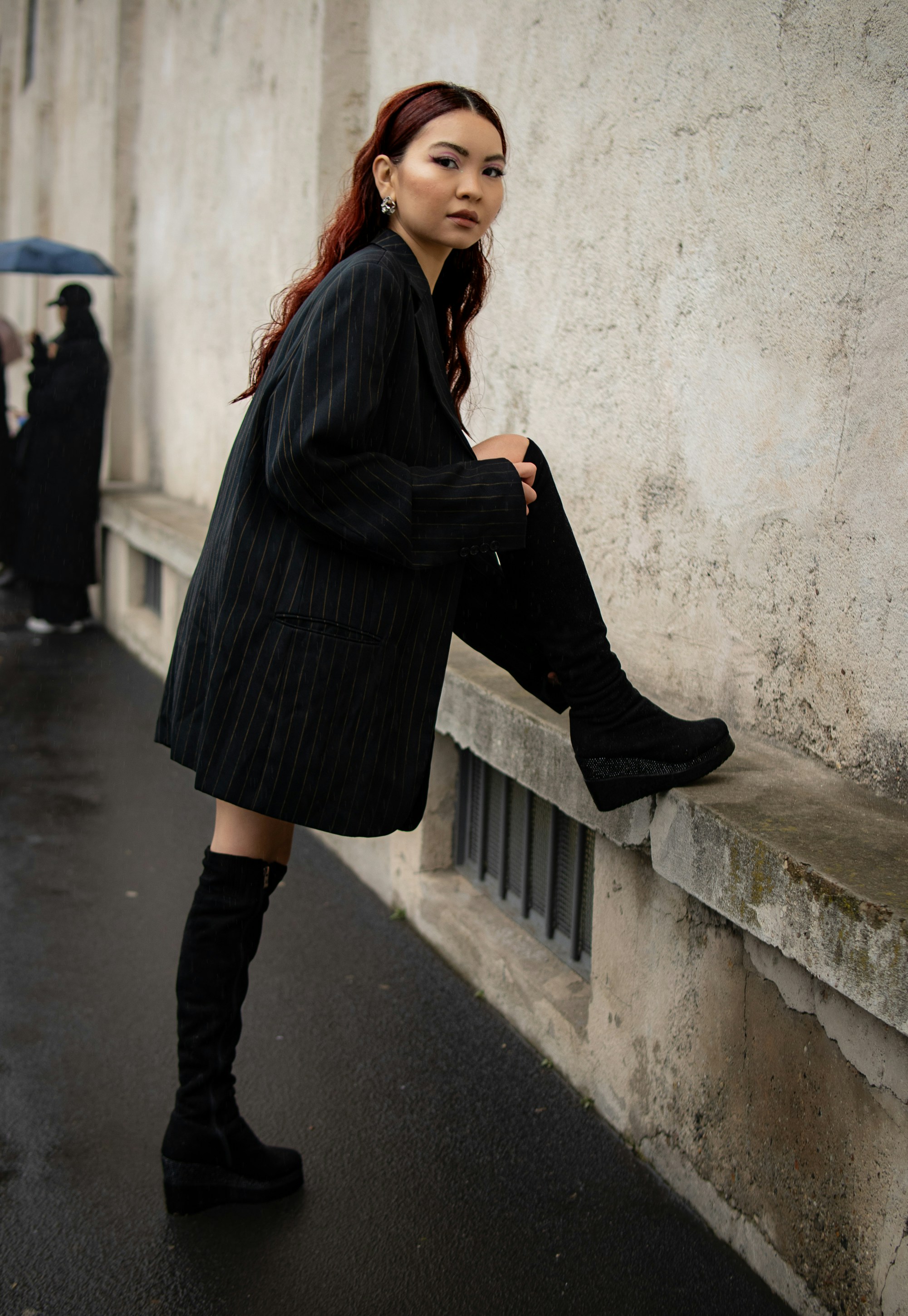 Pinstripe Poise on a Rain-Washed Wall