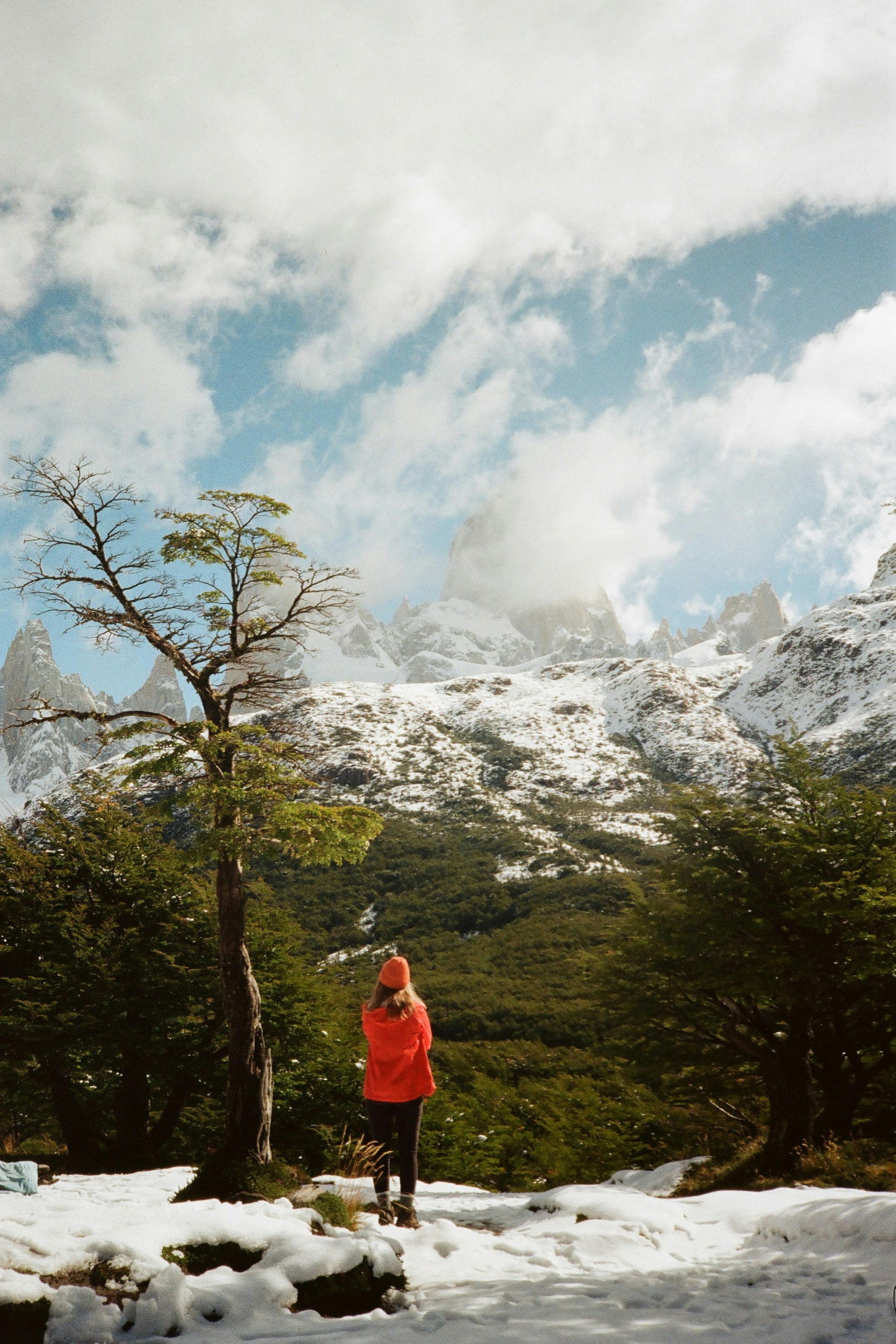 A person standing in the snow in front of a mountain photo – Free Fitz ...