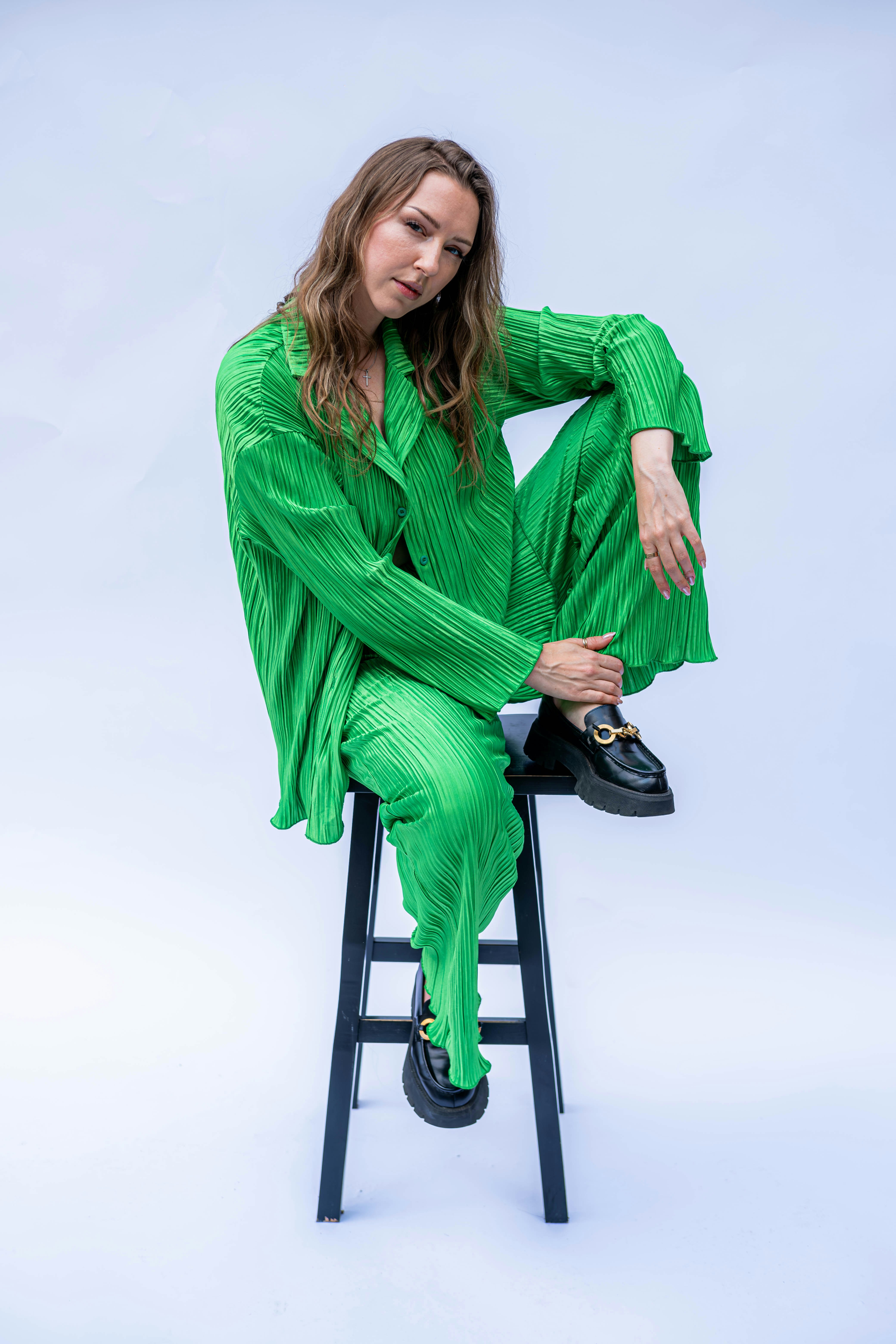 Emerald Threads: a Green-velvet Portrait on a Stool
