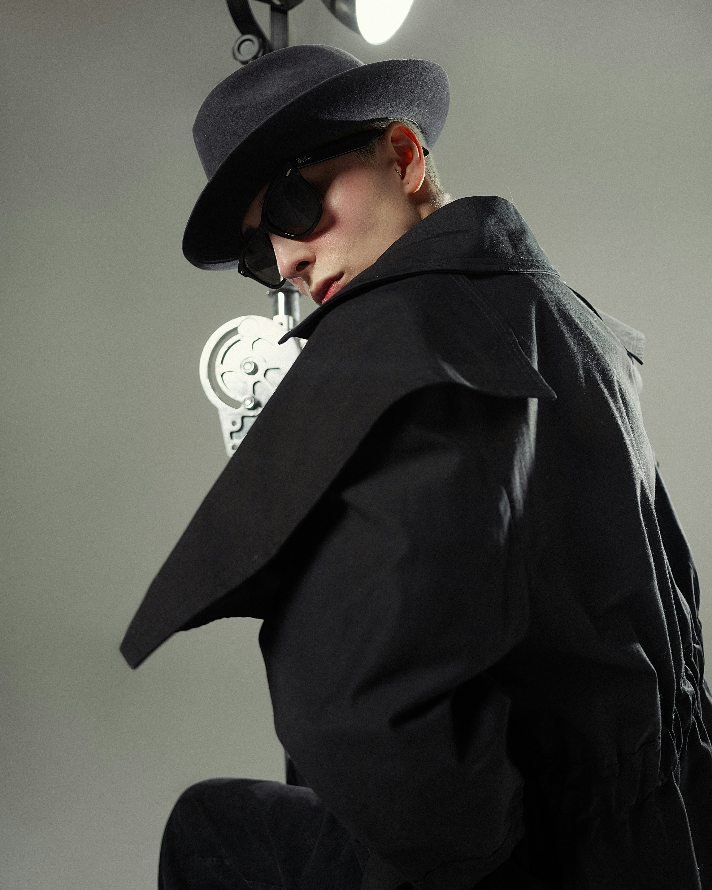 Shadowed Style: A Fashion Moment Under Studio Light