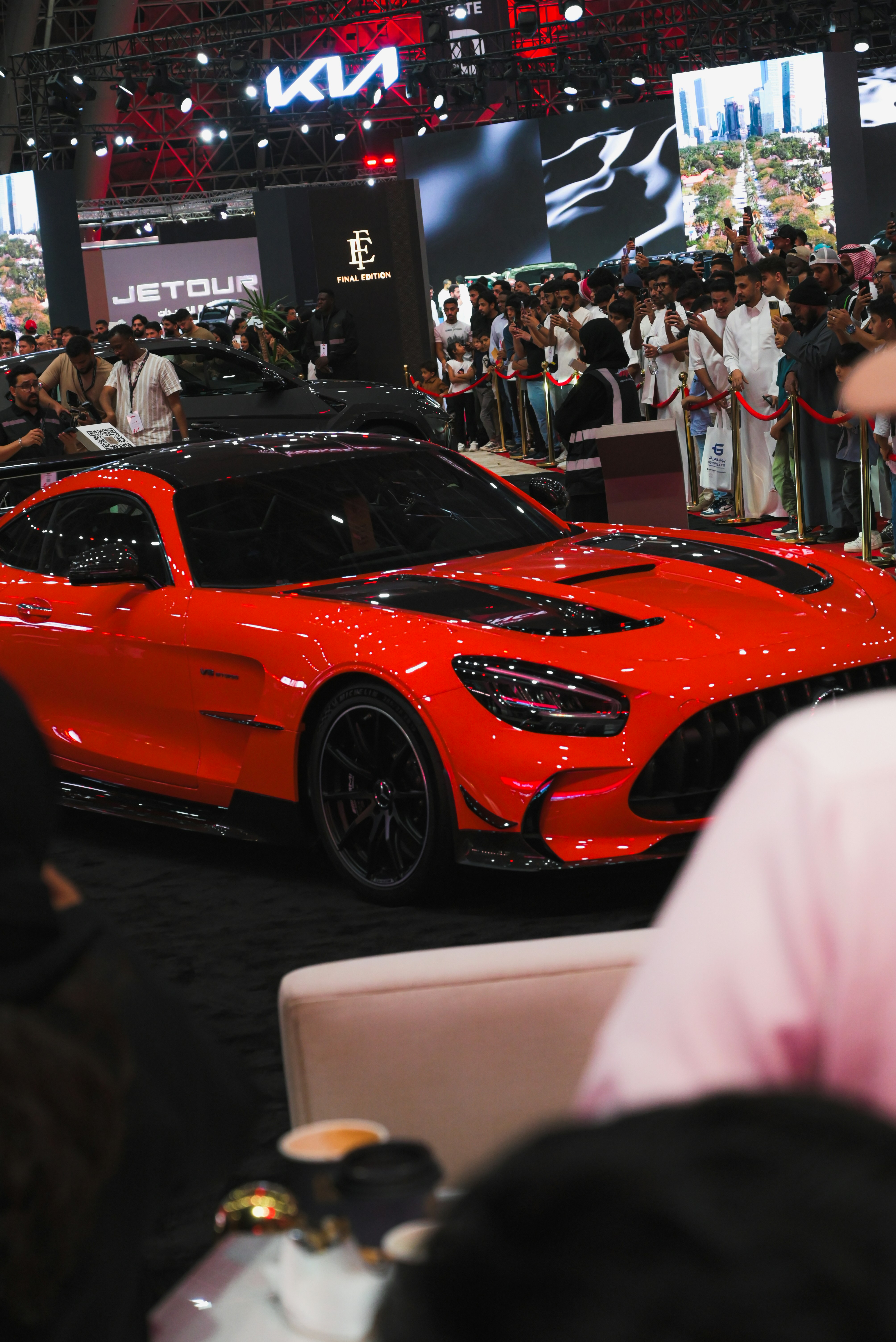 A red sports car on display at a car show photo – Free Automobile Image ...