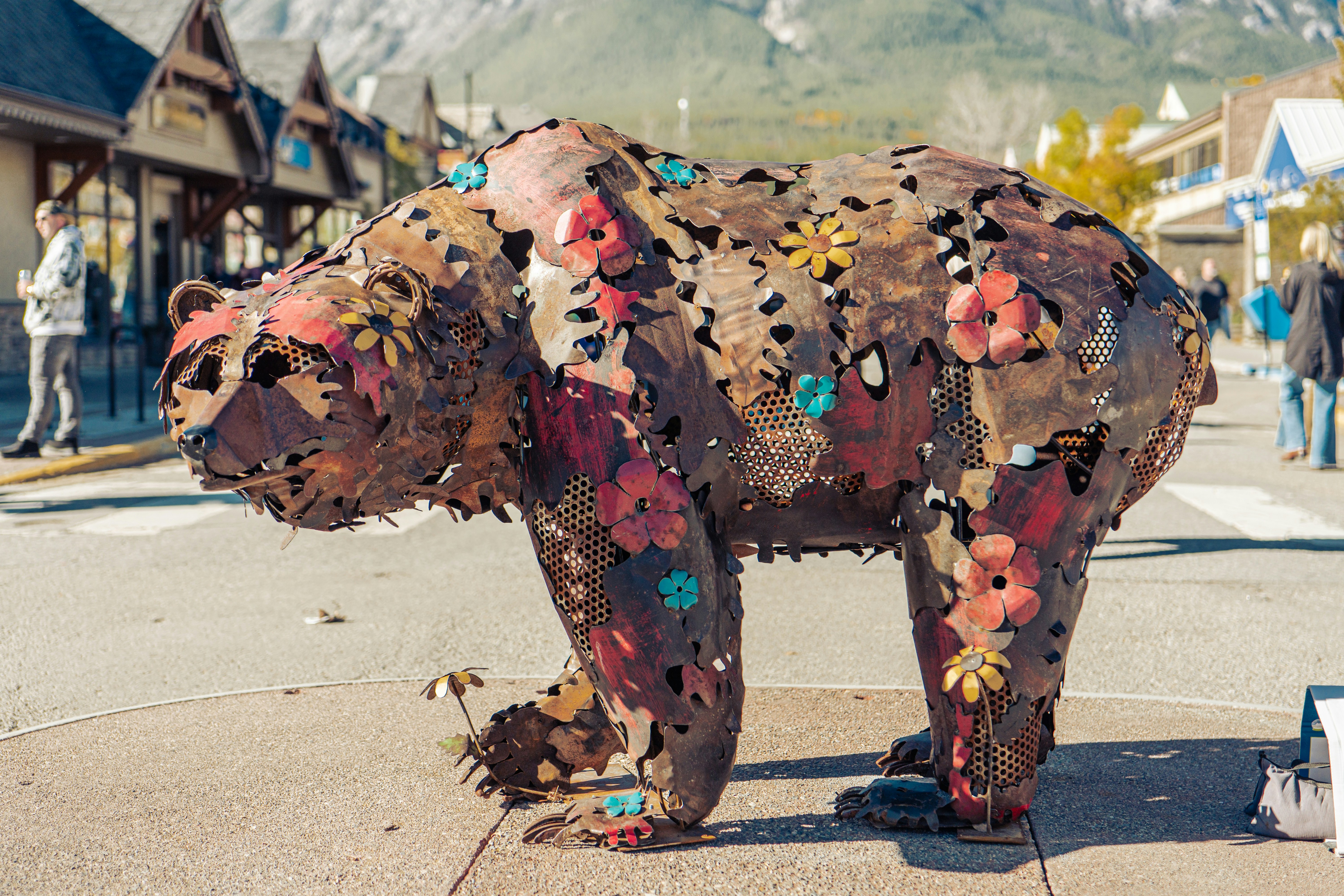 Floral-Armor Bear: A Perforated Metal Sculpture Guarding a Mountain Town Street