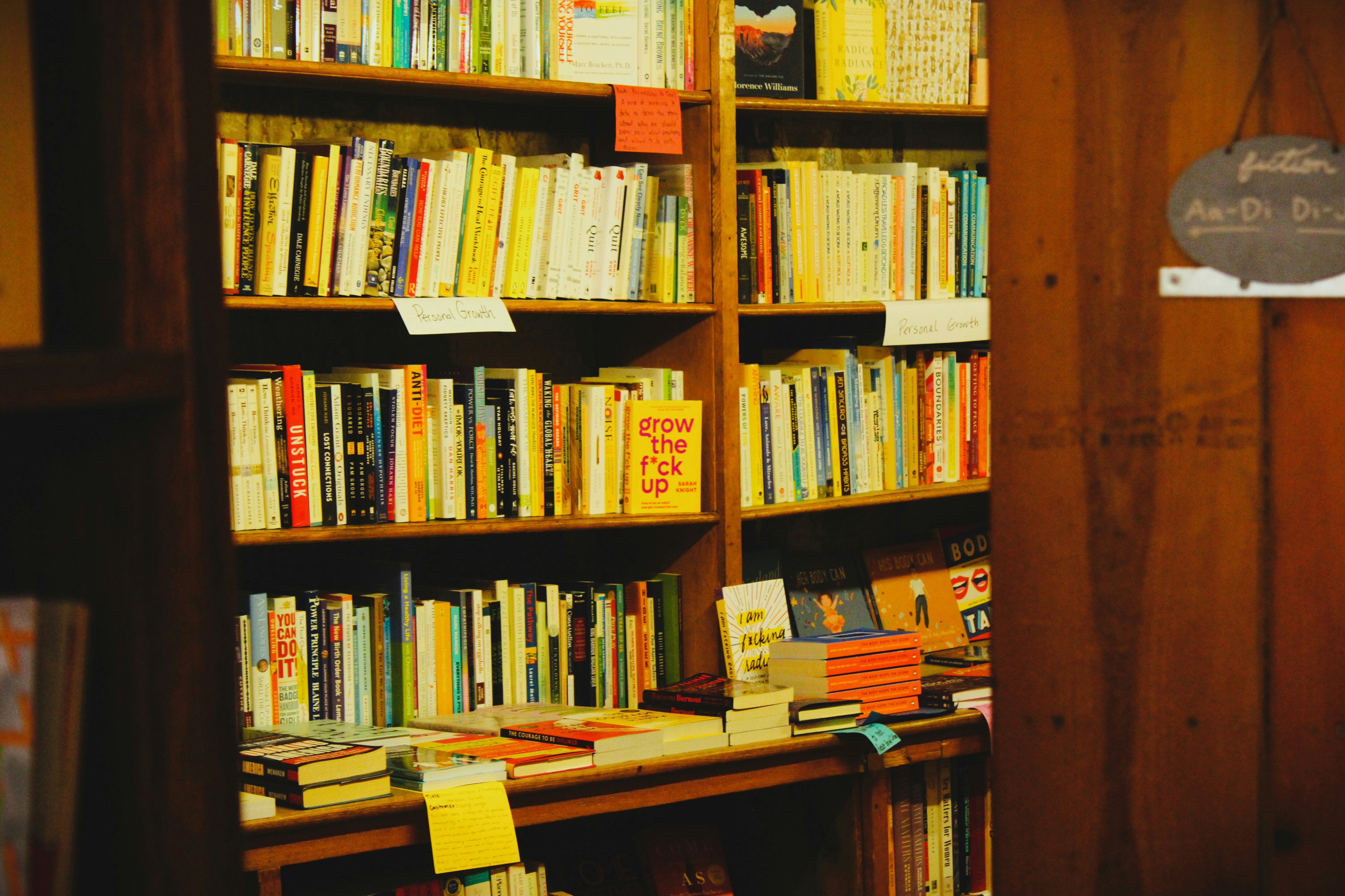 A bookshelf filled with lots of books in a library photo – Free ...