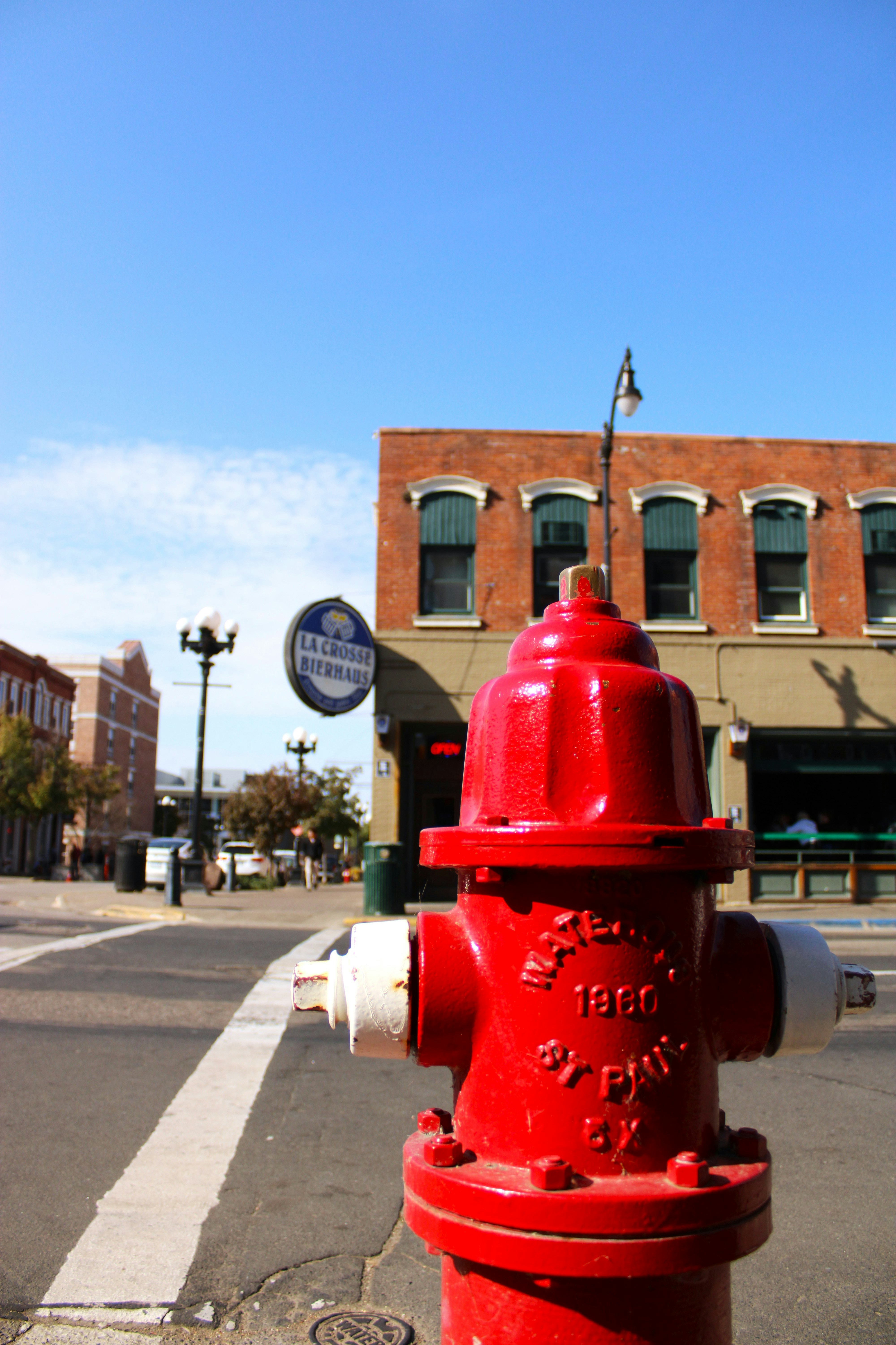 A red fire hydrant sitting on the side of a road photo – Free Image on ...