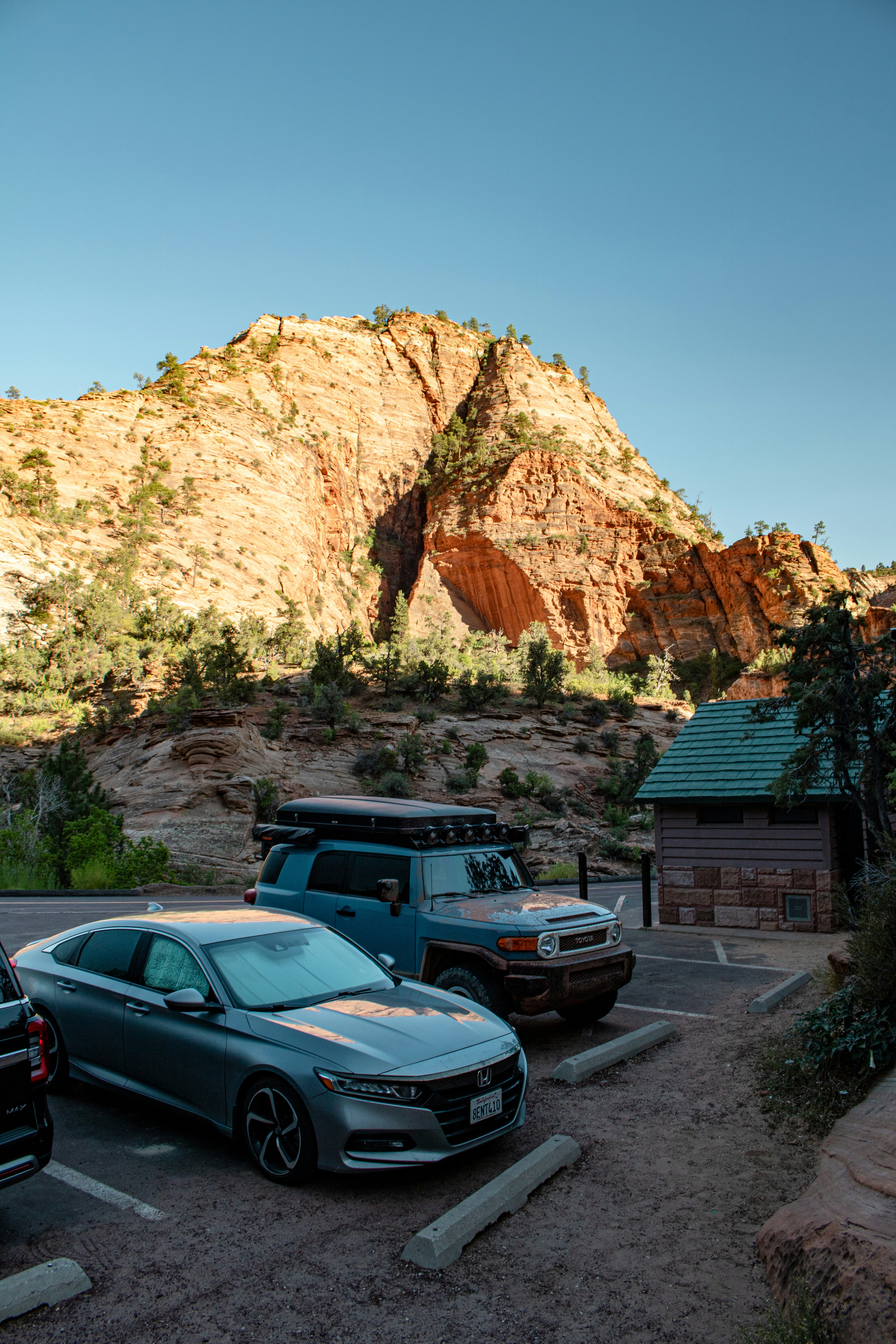 Checkerboard Mesa is a striking geological feature located in Zion National Park, characterized by its unique dome shape and distinctive cross-hatching pattern. This pattern, created by the combined effects of wind and erosion, gives the mesa its checkerboard appearance, making it a notable landmark in the park. Accessible via the Zion-Mount Carmel Highway, Checkerboard Mesa is surrounded by vibrant landscapes and offers stunning views of the colorful Navajo sandstone layers. It is a favorite spot for photographers and nature lovers exploring the beauty of Zion.