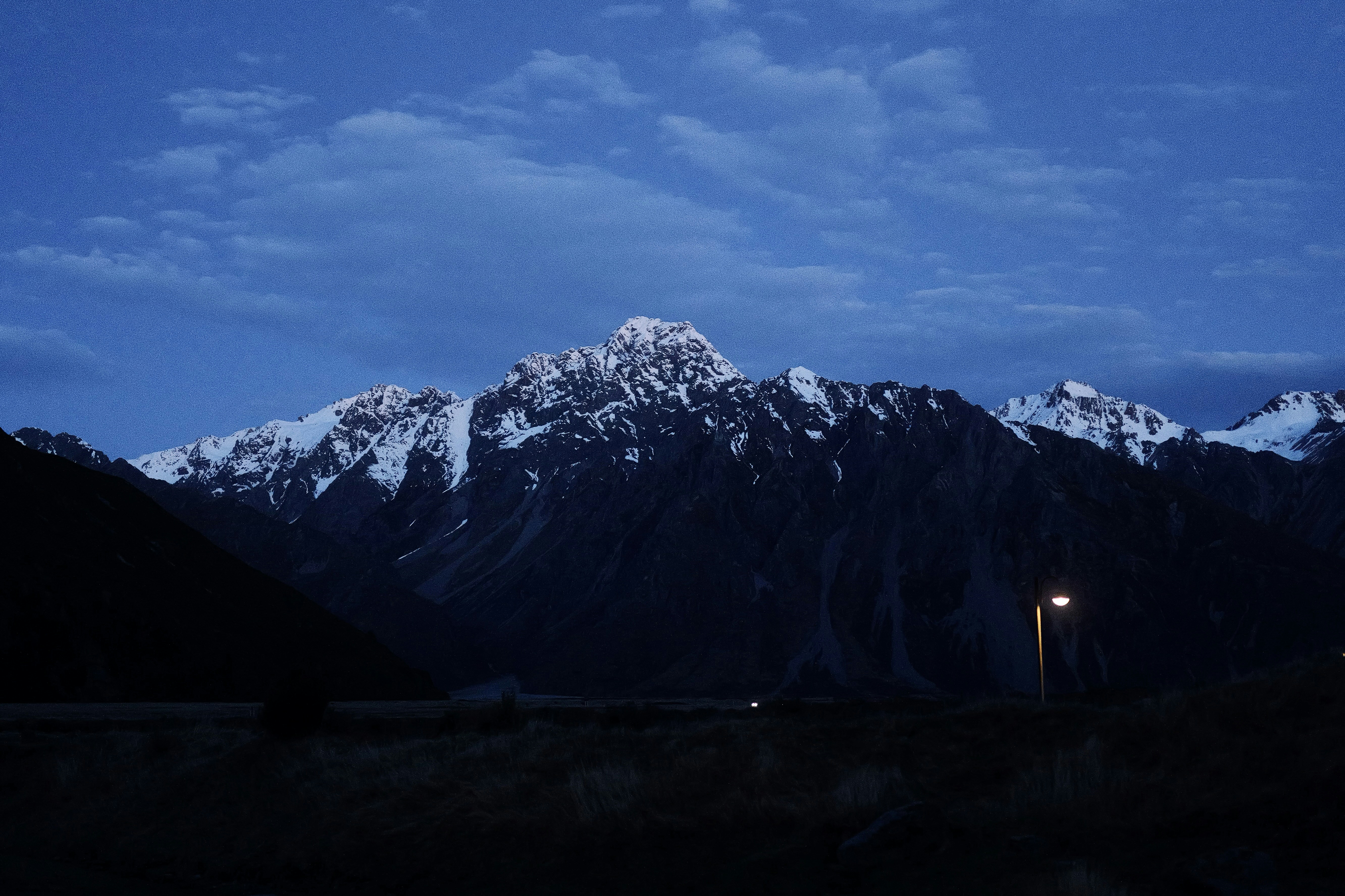 Twilight Ridge: Snow Peaks Under a Quiet Blue Sky