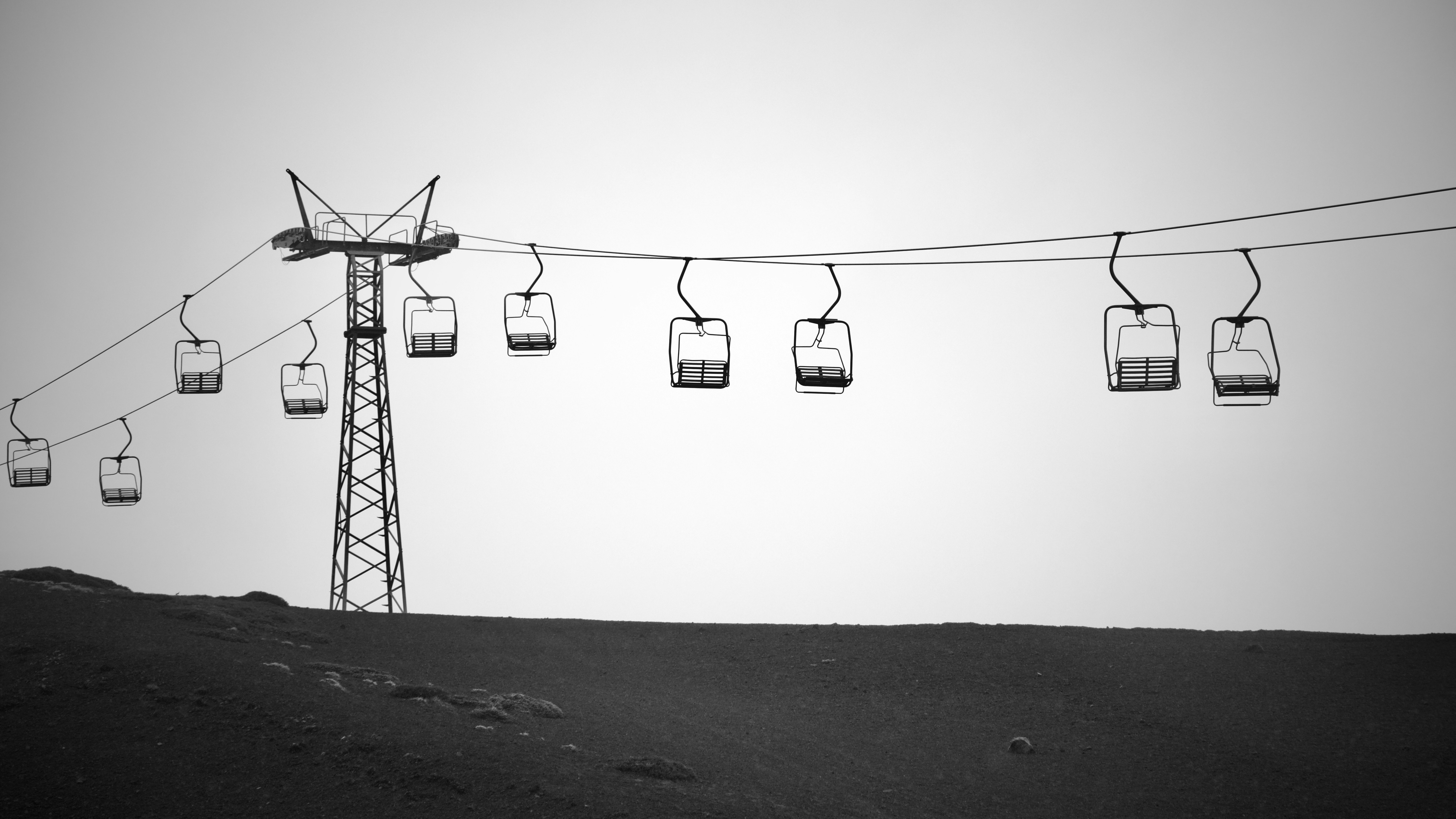 Silent Ascent: Chairlifts Against the Sky