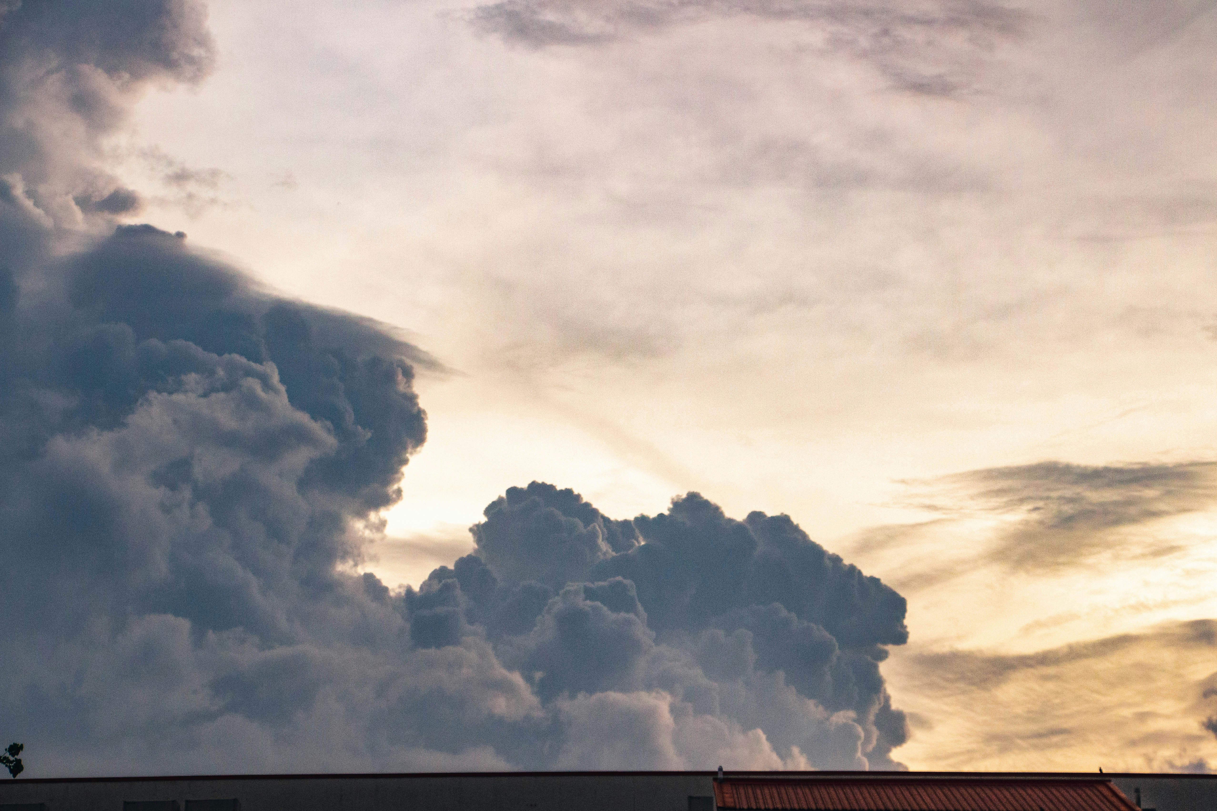 Cumulus Tower at Dawn: A Rooftop Horizon Beneath a Golden Sky