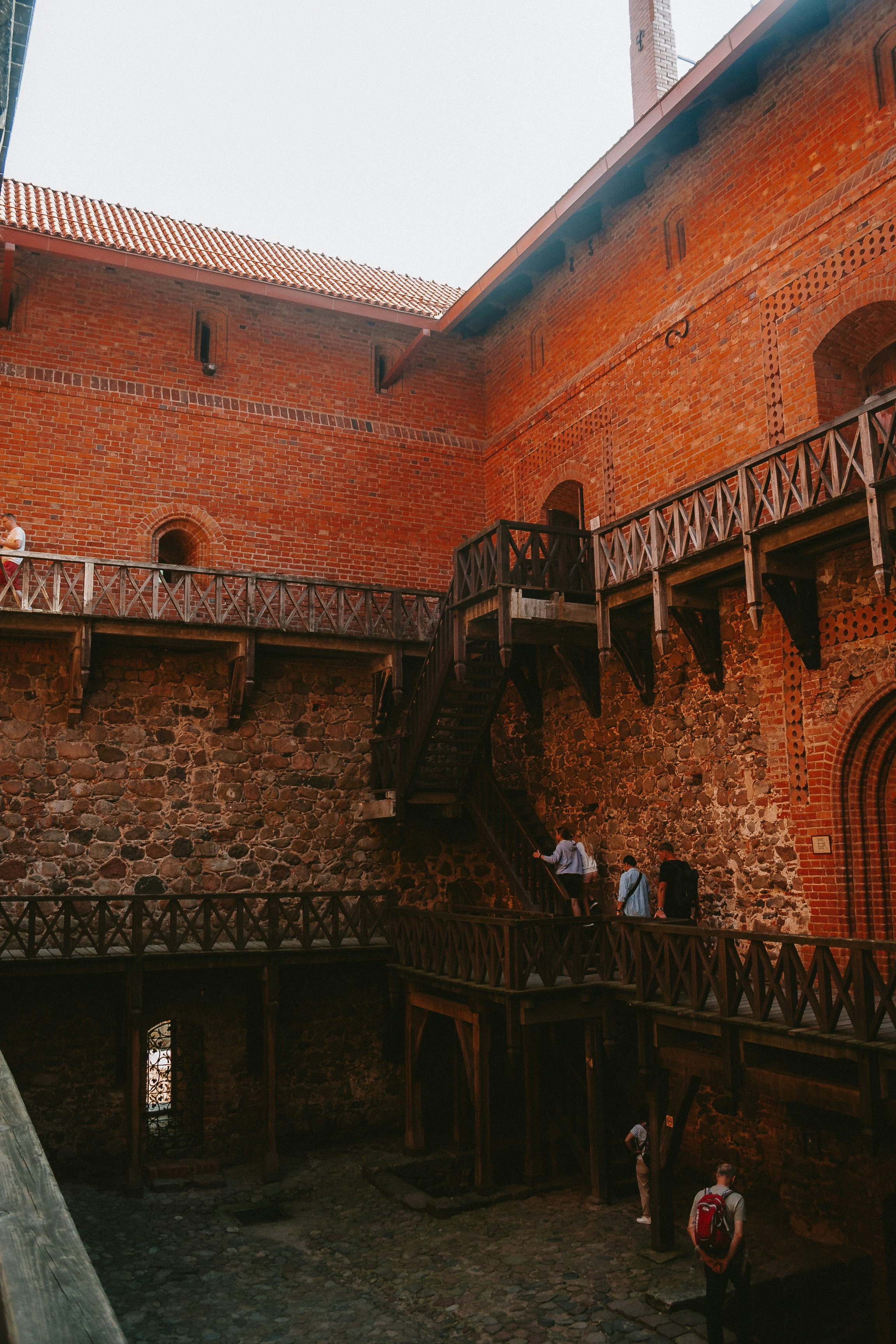 Inner Courtyard Echoes: Staircase and Brickwork in Evening Light