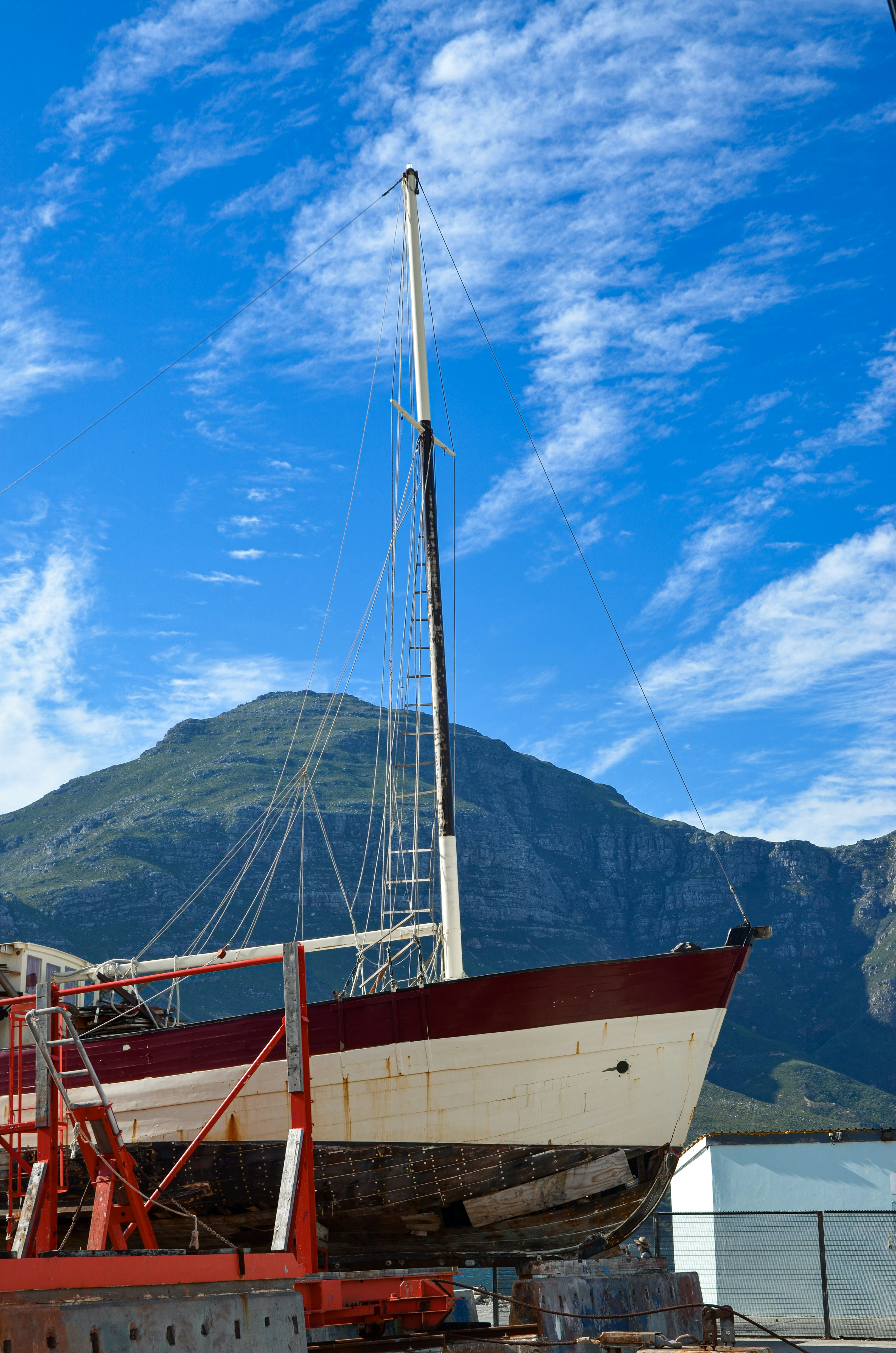 Sail Under a Blue Gaze: A Shipyard Vista Below Alpine Silence