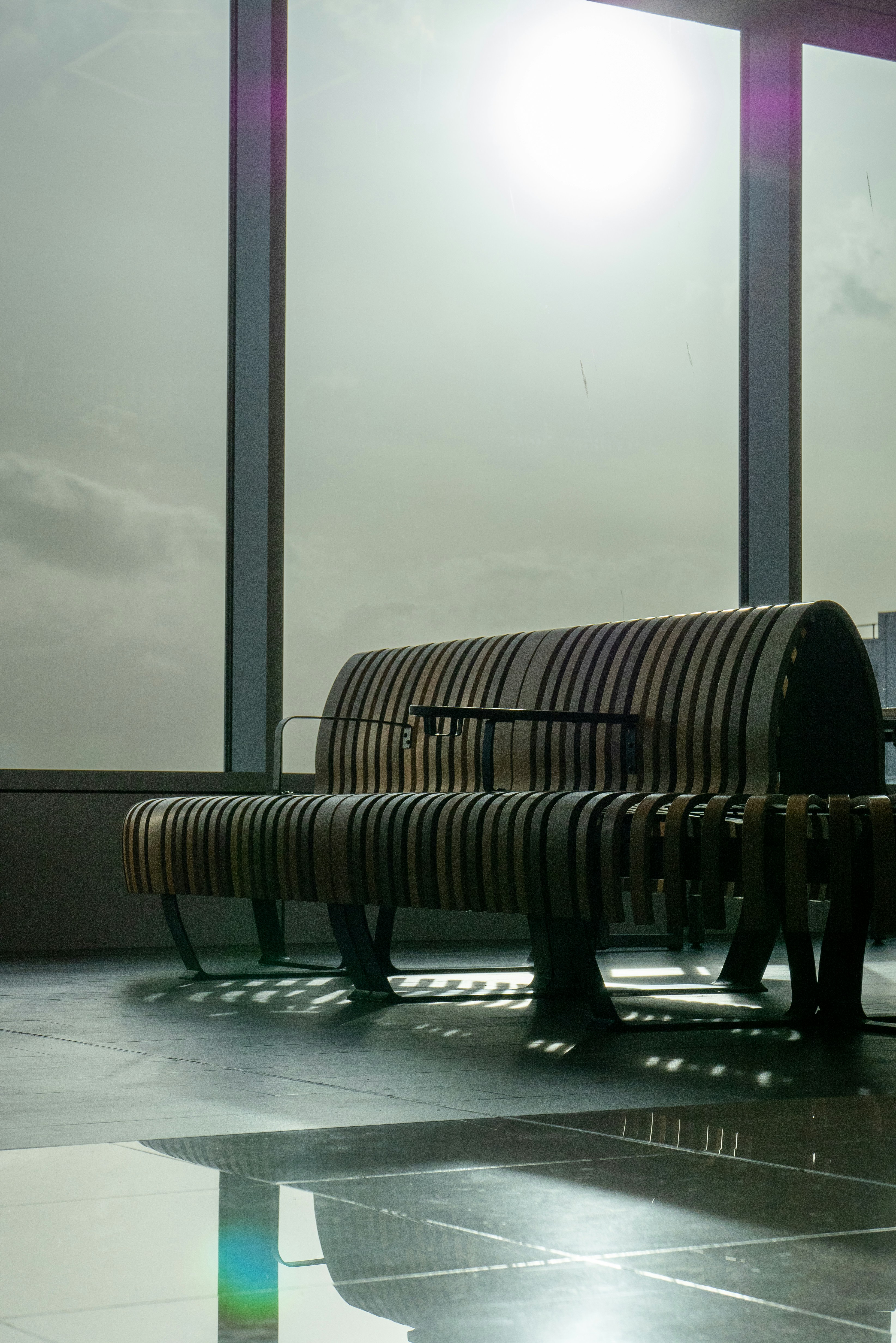 Sunlit Bench Beneath a Glass Atrium