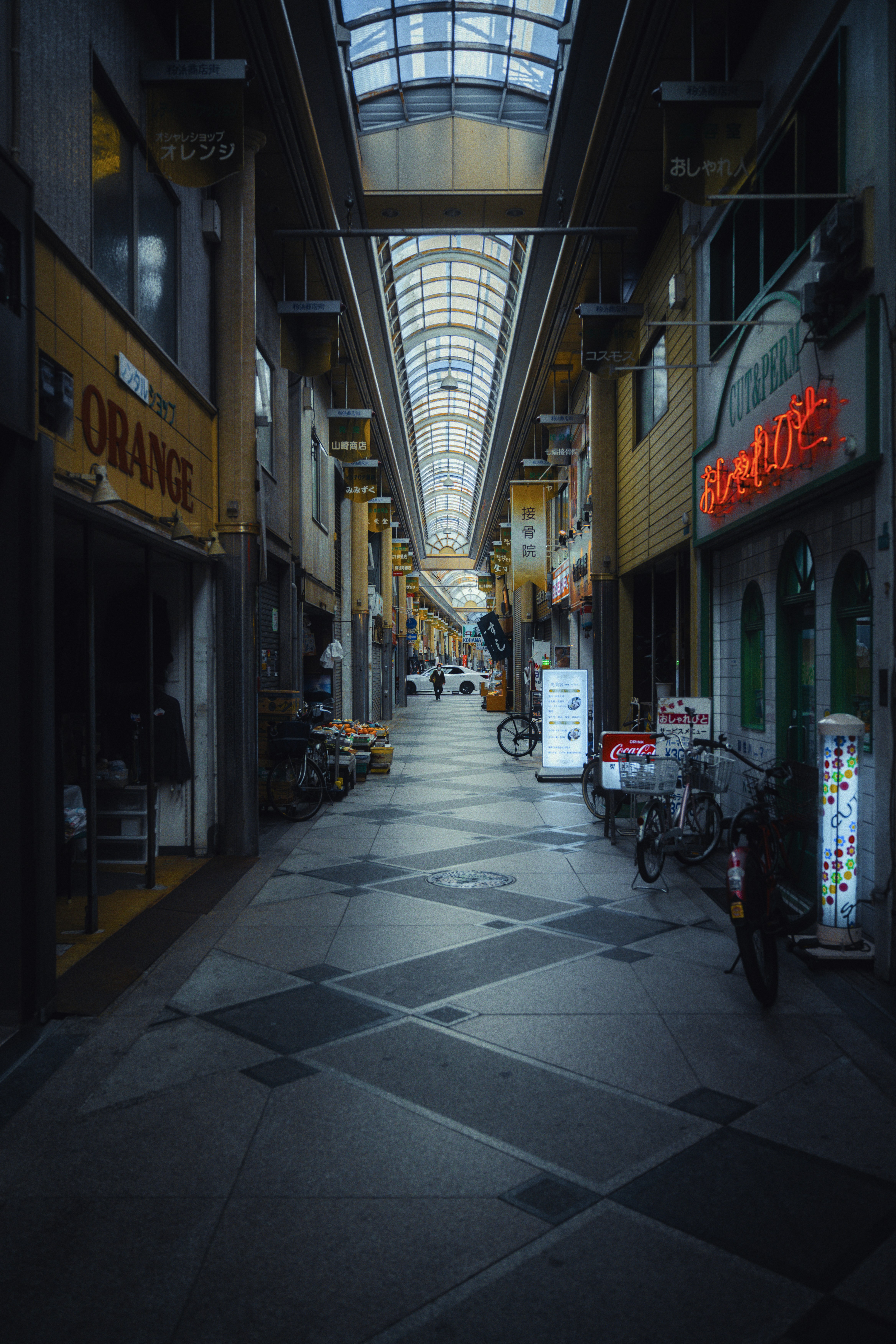 A narrow city street with a skylight above it photo – Free Osaka Image ...