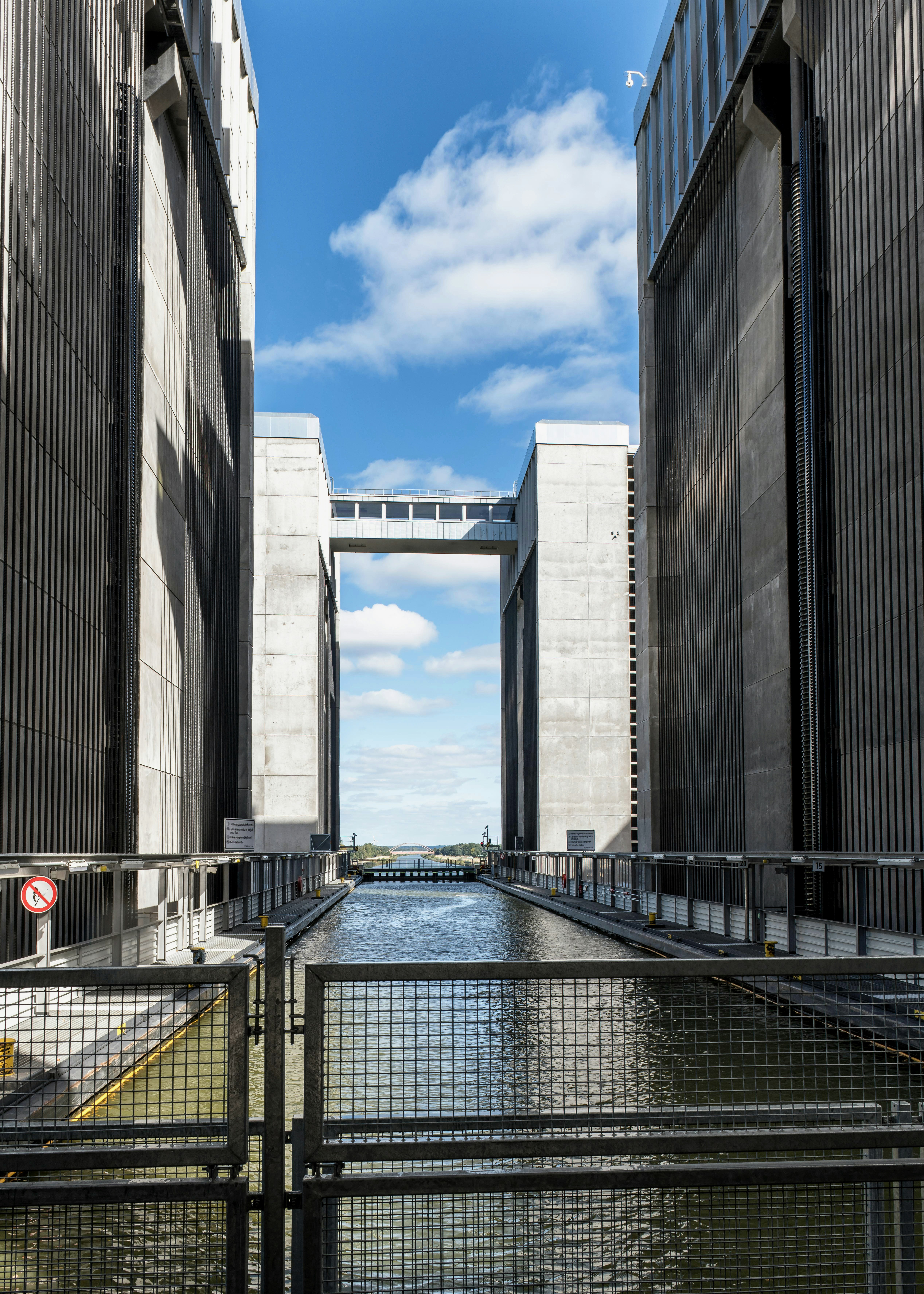 A view of a waterway between two buildings photo – Free Museum Image on ...