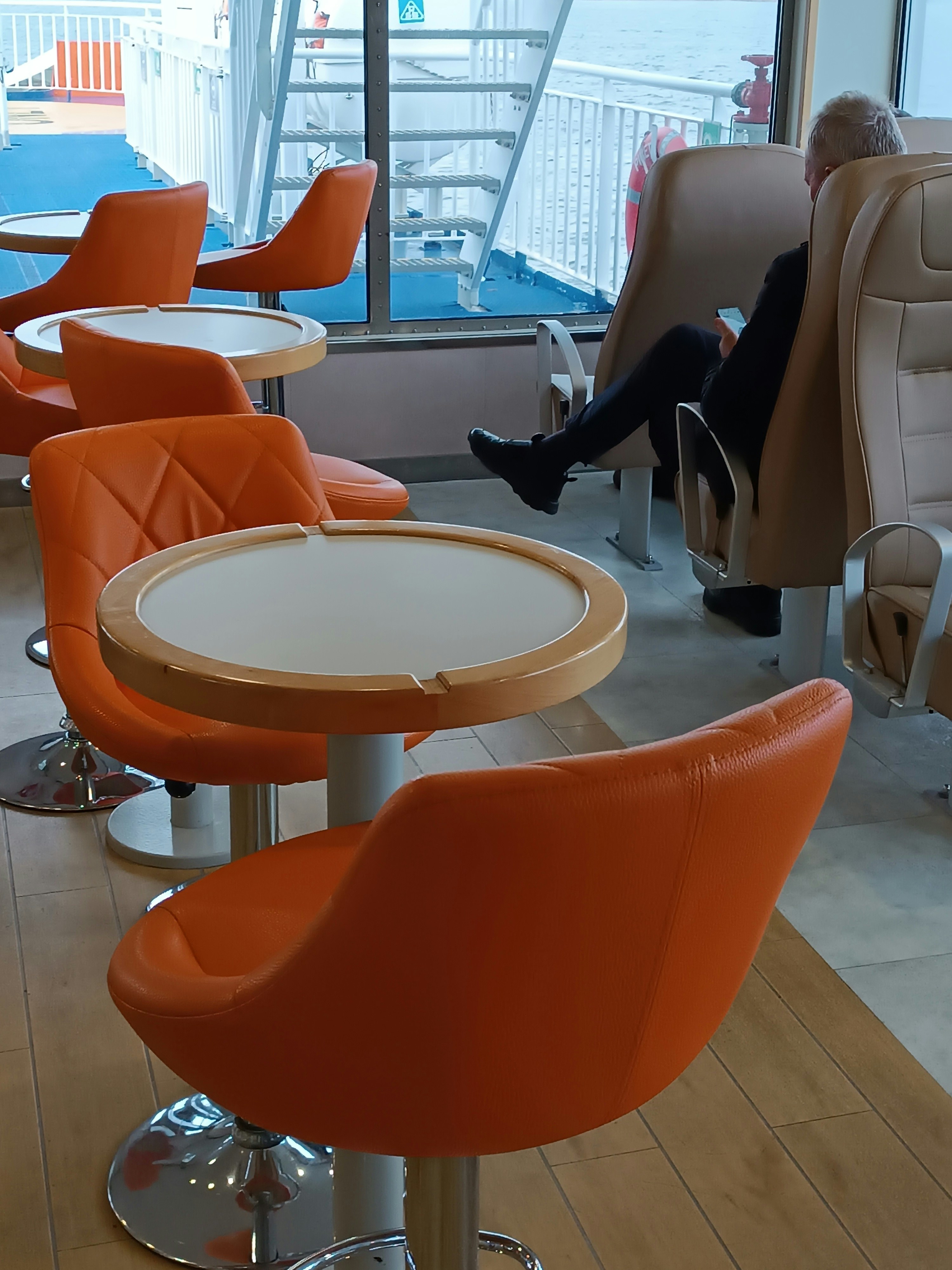 Orange Lounge at Sea: A Quiet Cruise Deck Cafe
