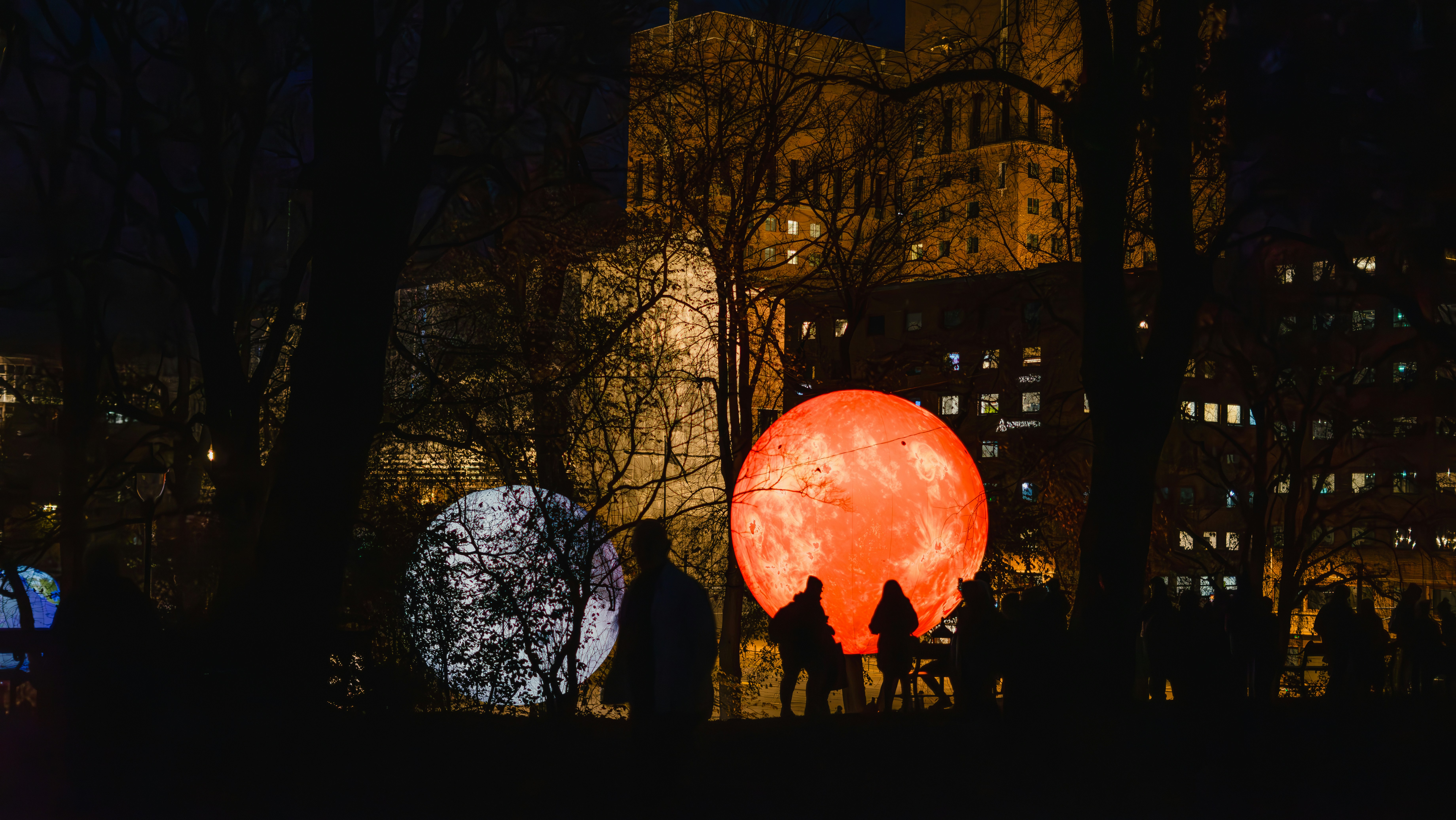 A group of people standing in front of a giant ball photo – Free Oslo ...